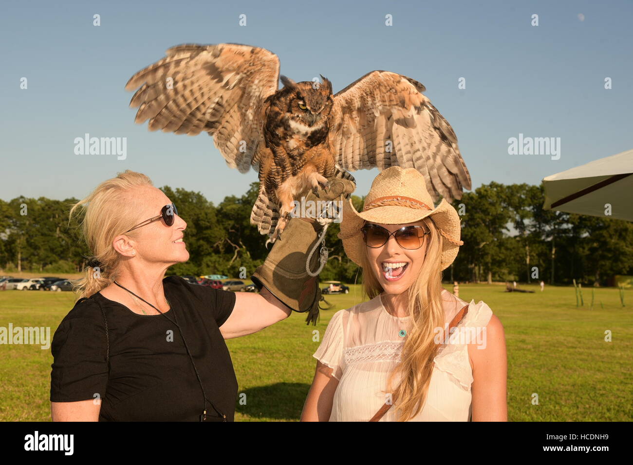 Jane Gill with Kalala, a Great Horned Owl, and Beth Stern attending the ...