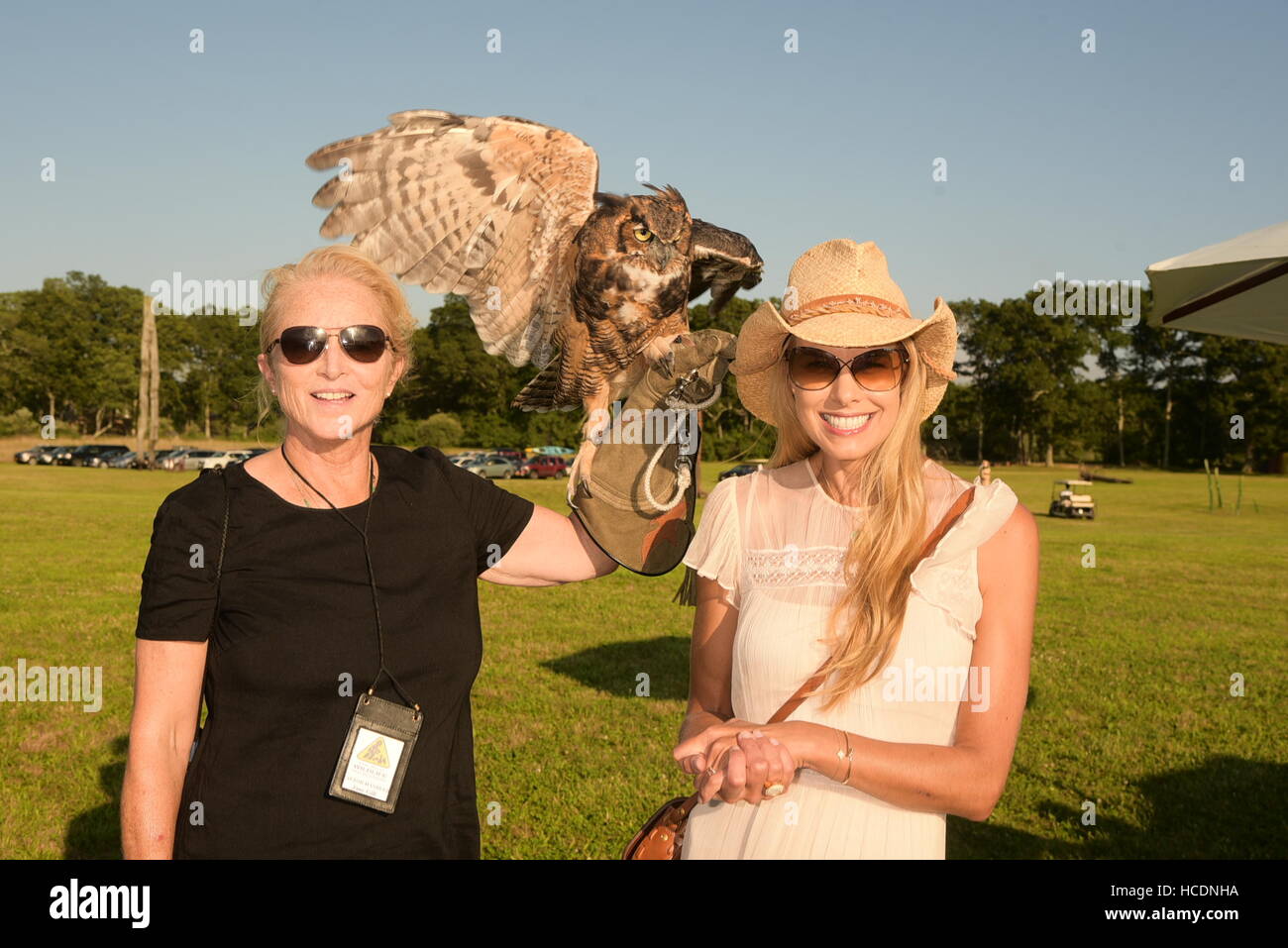 Jane Gill with Kalala, a Great Horned Owl, and Beth Stern attending the ...