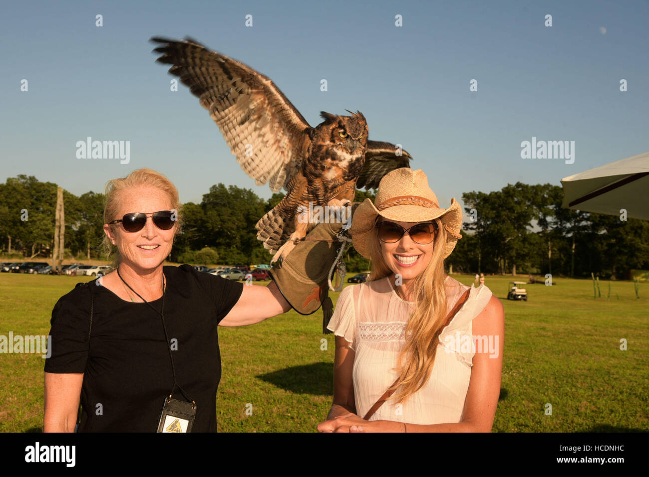 Jane Gill with Kalala, a Great Horned Owl, and Beth Stern attending the ...