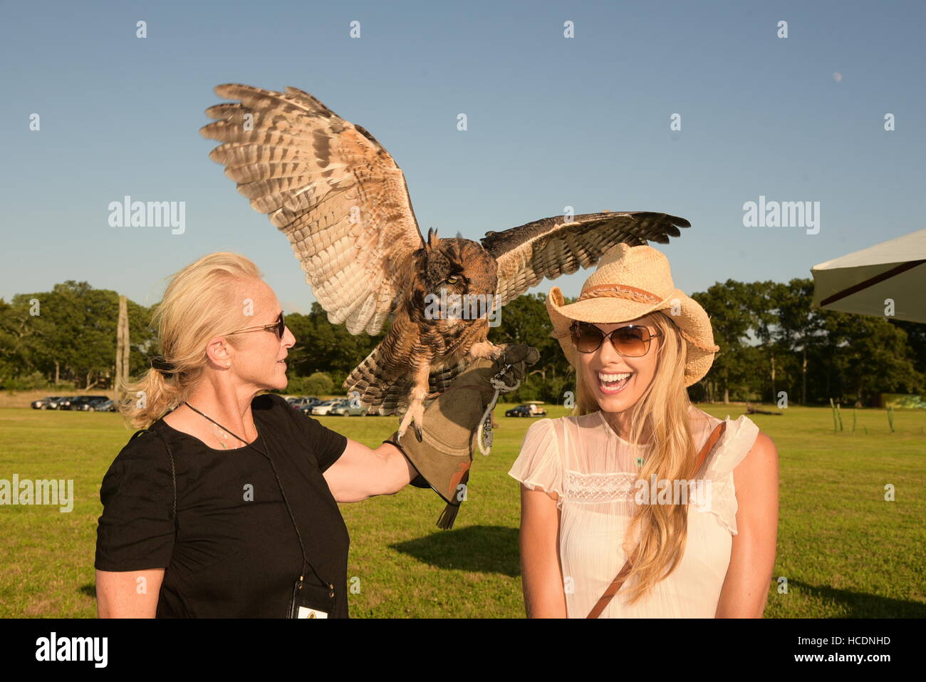 Jane Gill with Kalala, a Great Horned Owl, and Beth Stern attending the ...
