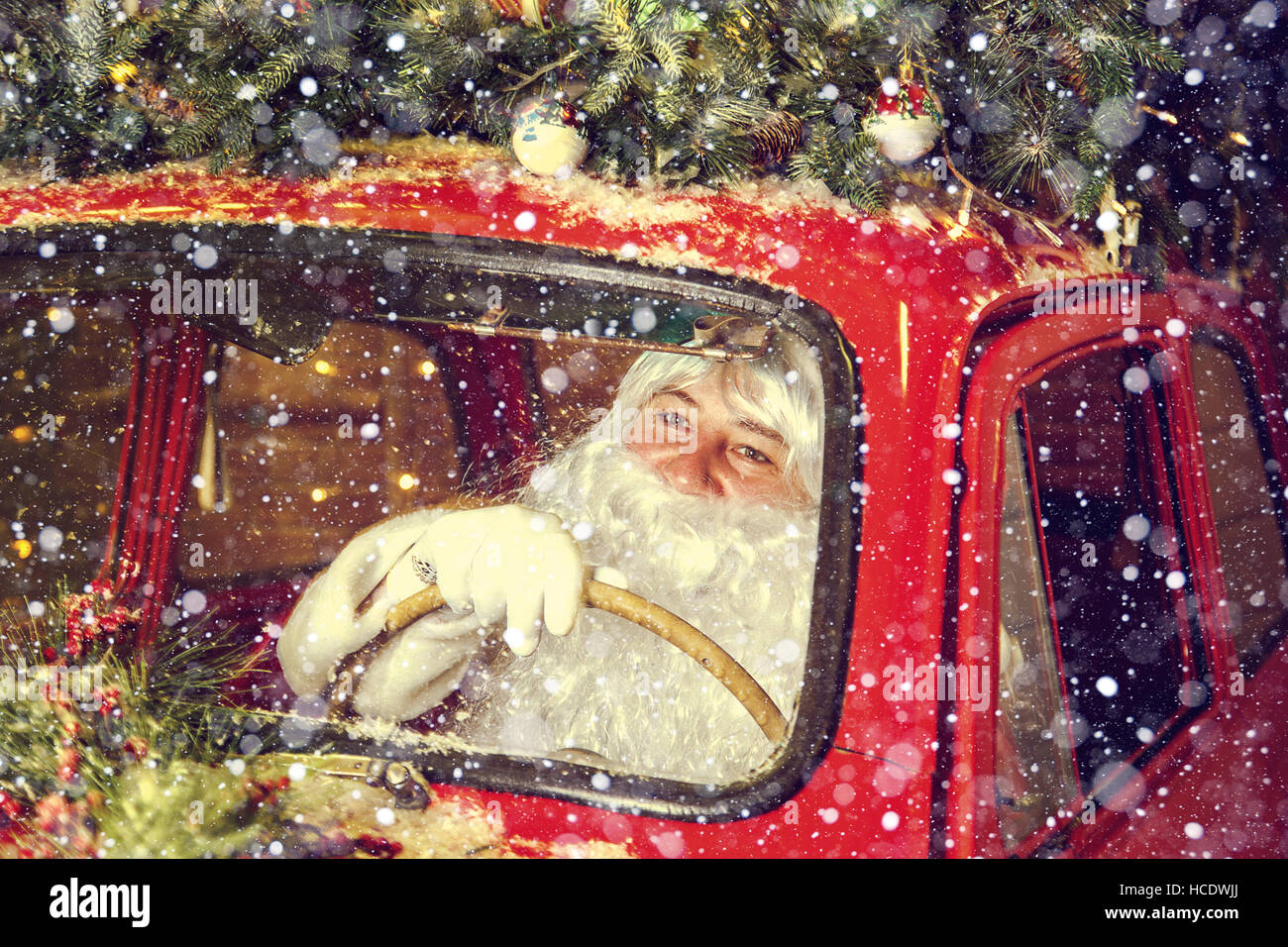 Portrait of Santa Claus. Santa Claus is driving a car. Selective focus ...