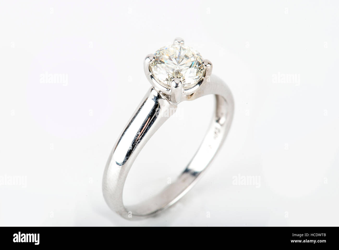 Diamond ring with gold and silver and precious stones. Shot standing up ...