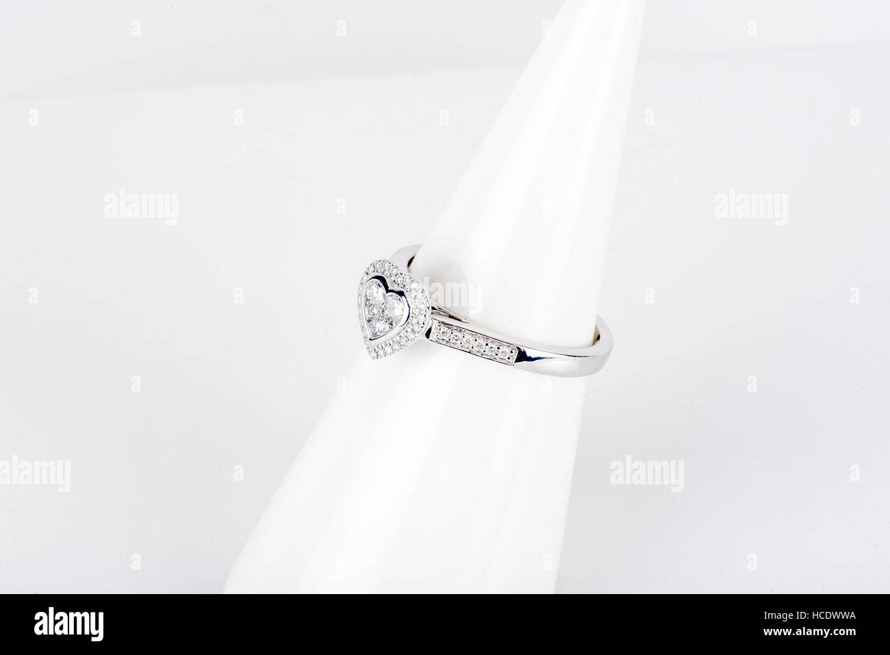 Diamond ring with gold and silver and precious stones. Shot standing up ...