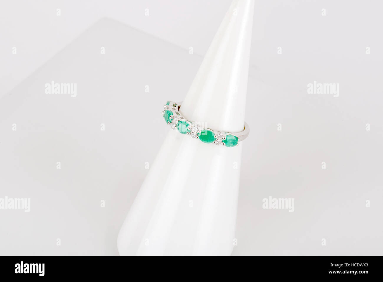 Diamond ring with gold and silver and precious stones. Shot standing up ...