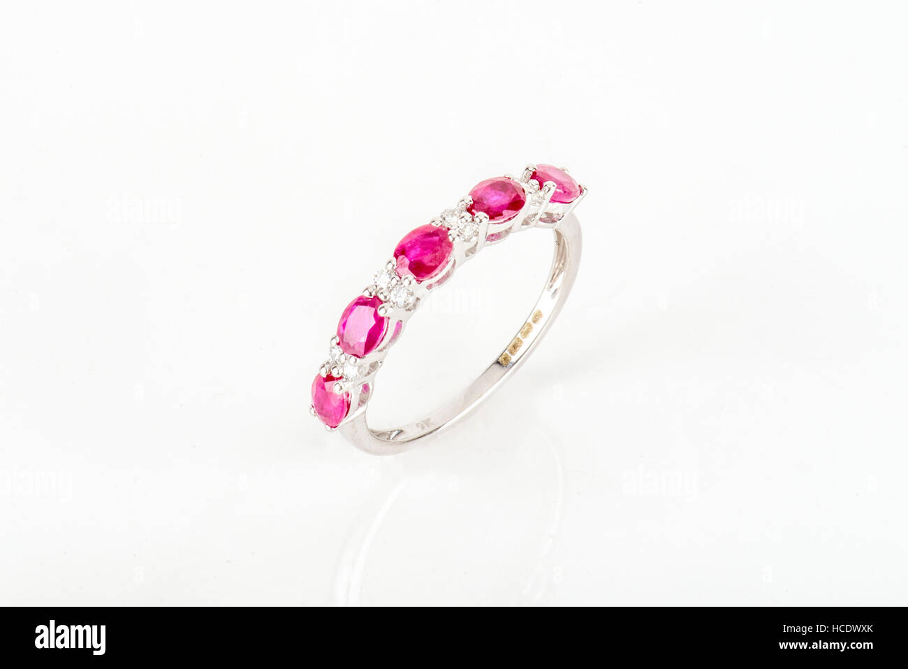 Diamond ring with gold and silver and precious stones. Shot standing up ...