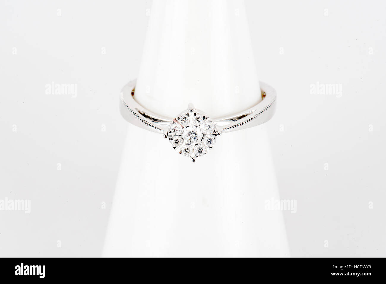 Diamond ring with gold and silver and precious stones. Shot standing up ...