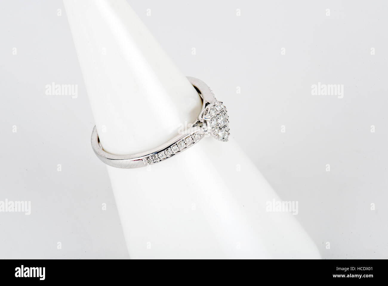 Diamond ring with gold and silver and precious stones. Shot standing up ...