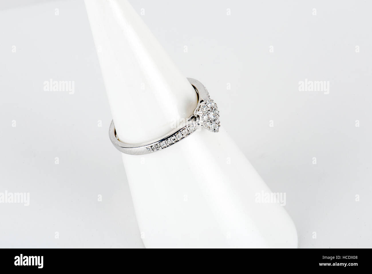 Diamond ring with gold and silver and precious stones. Shot standing up ...