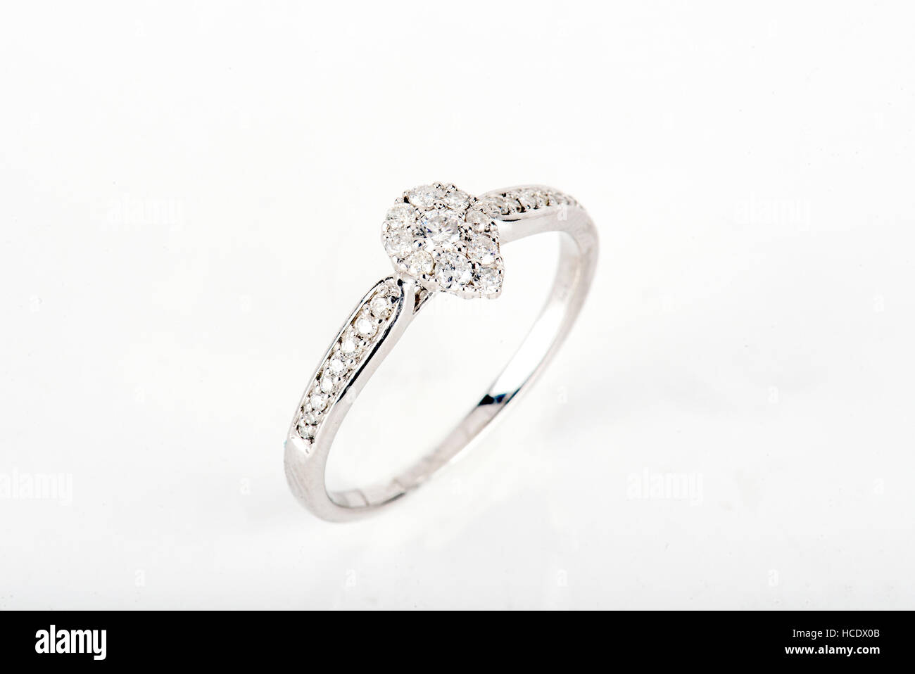 Diamond ring with gold and silver and precious stones. Shot standing up ...