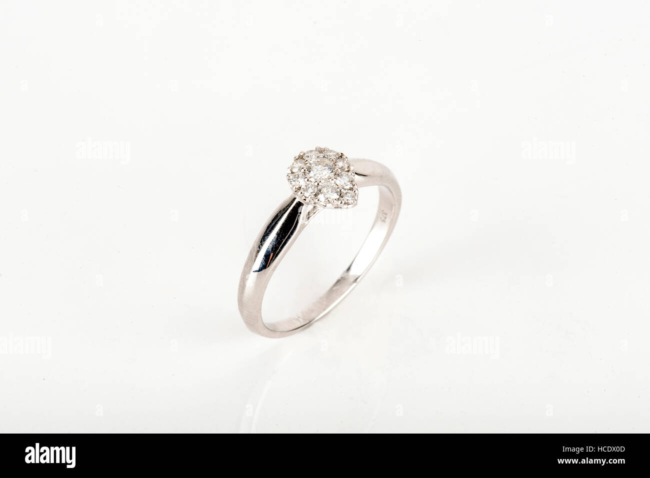 Diamond ring with gold and silver and precious stones. Shot standing up ...