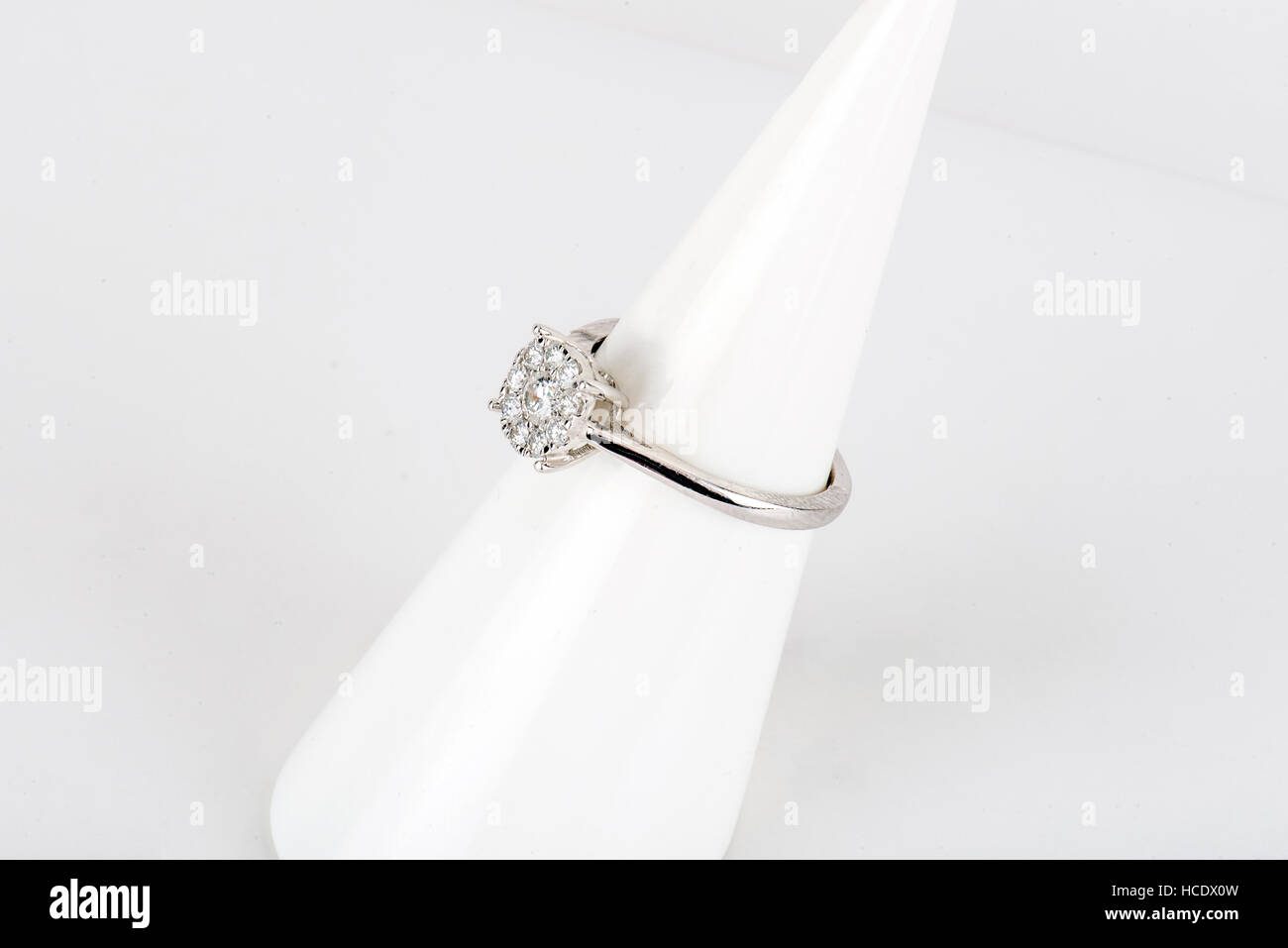 Diamond ring with gold and silver and precious stones. Shot standing up ...