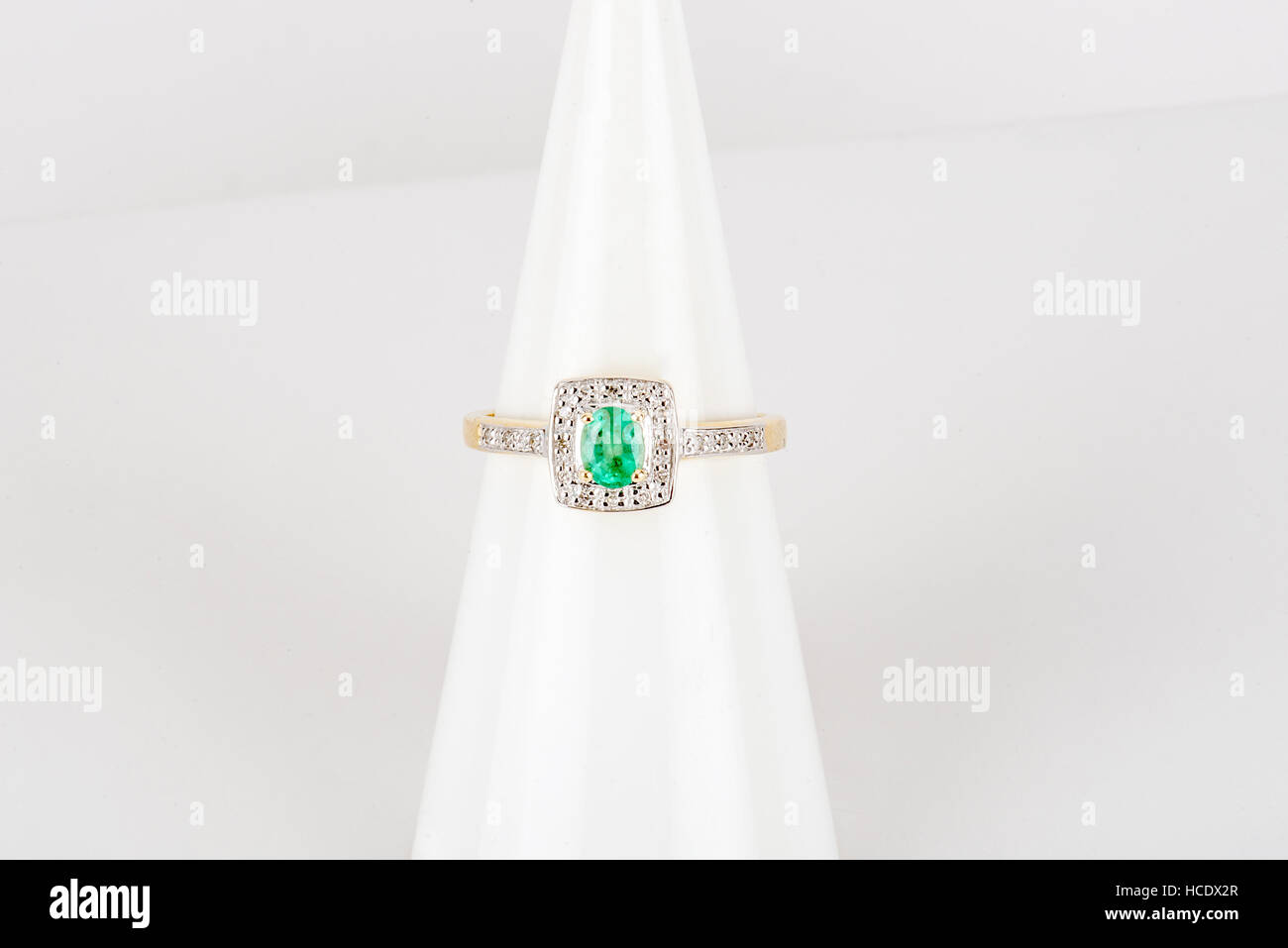 Diamond ring with gold and silver and precious stones. Shot standing up ...