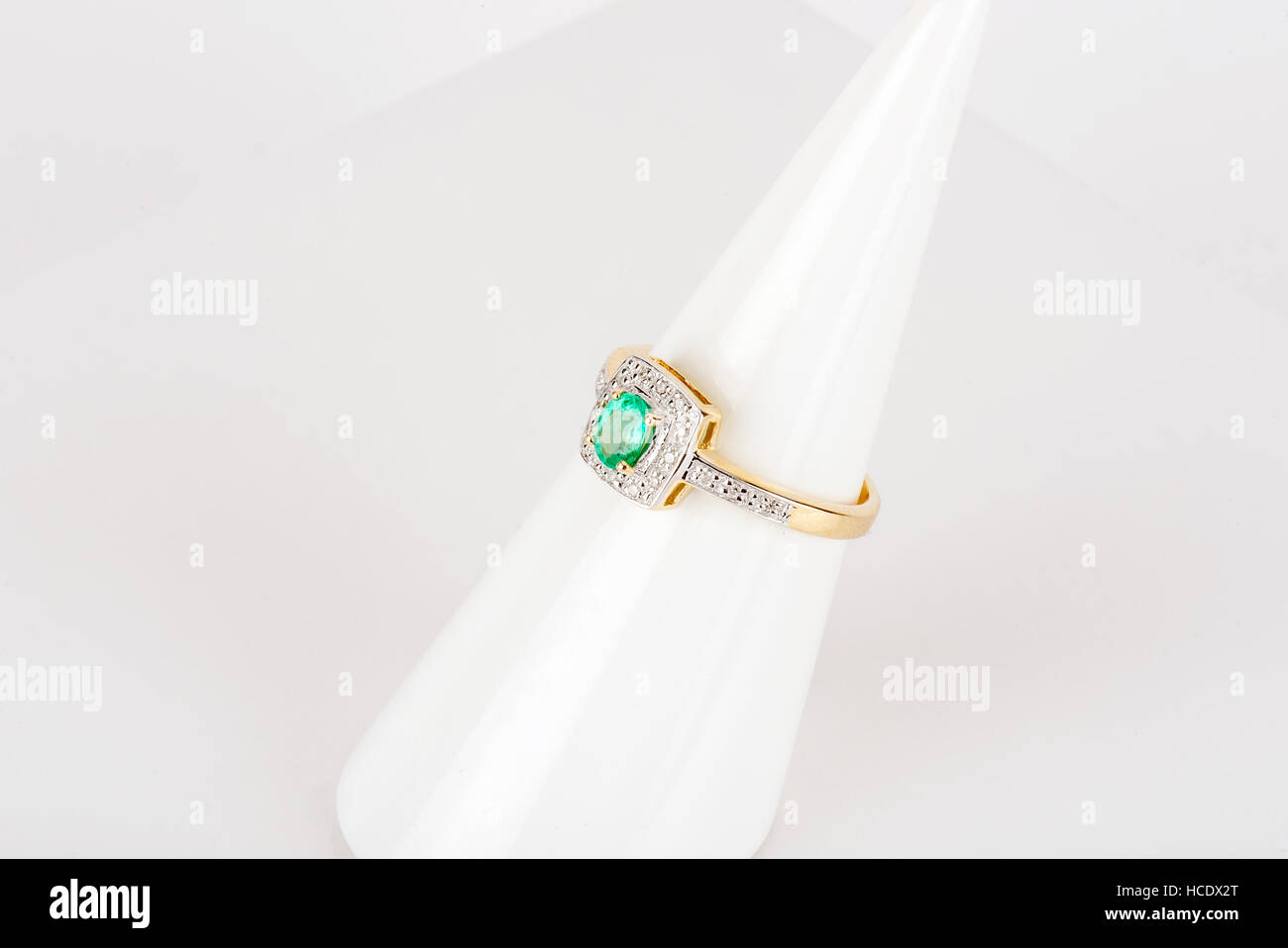 Diamond ring with gold and silver and precious stones. Shot standing up ...