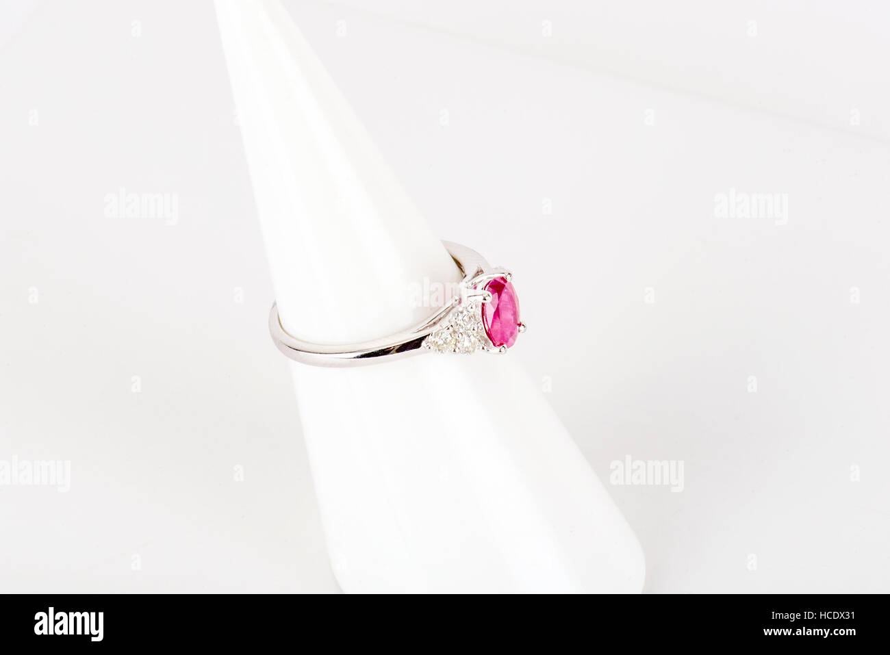 Diamond ring with gold and silver and precious stones. Shot standing up ...