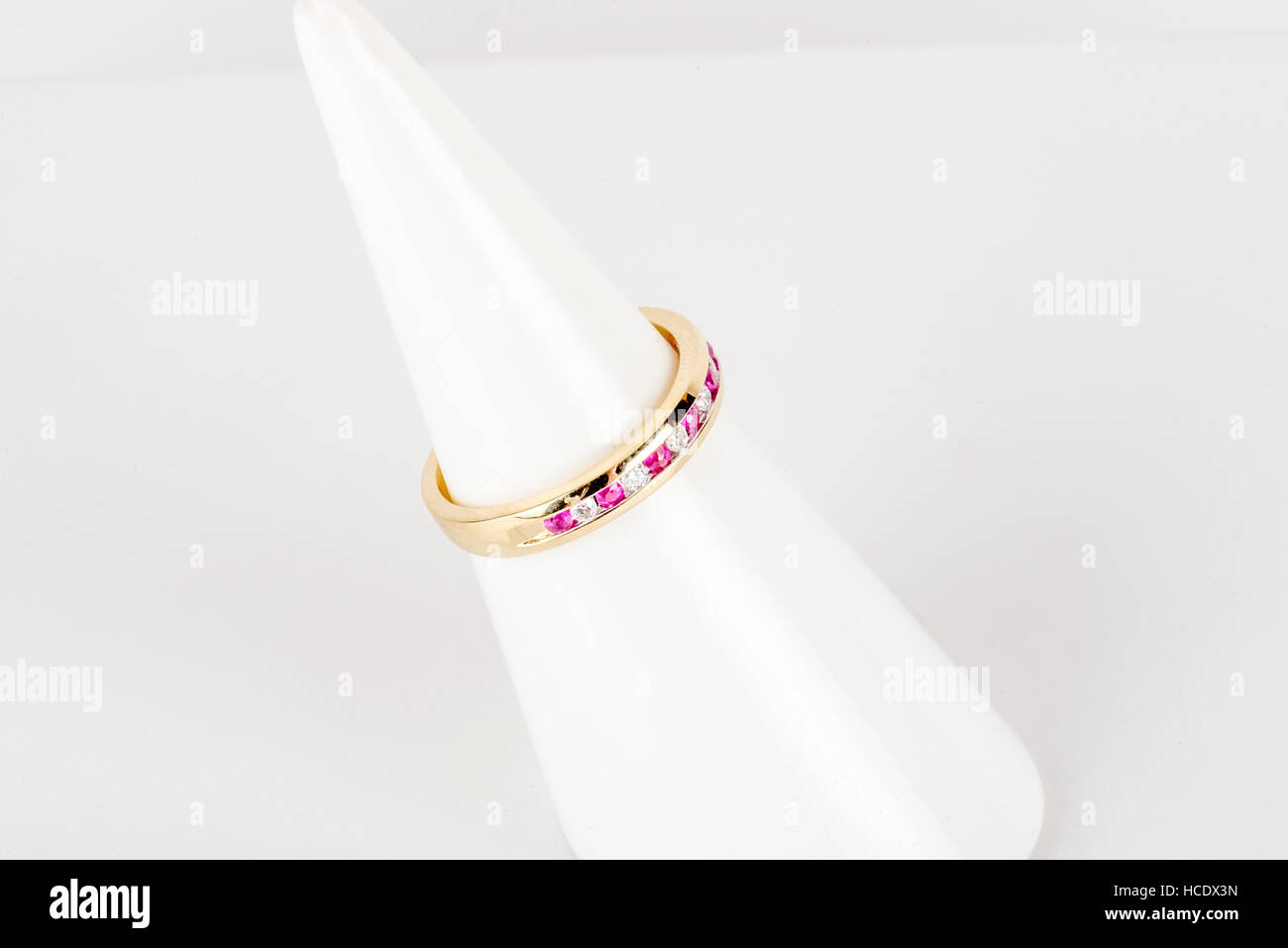 Diamond ring with gold and silver and precious stones. Shot standing up ...