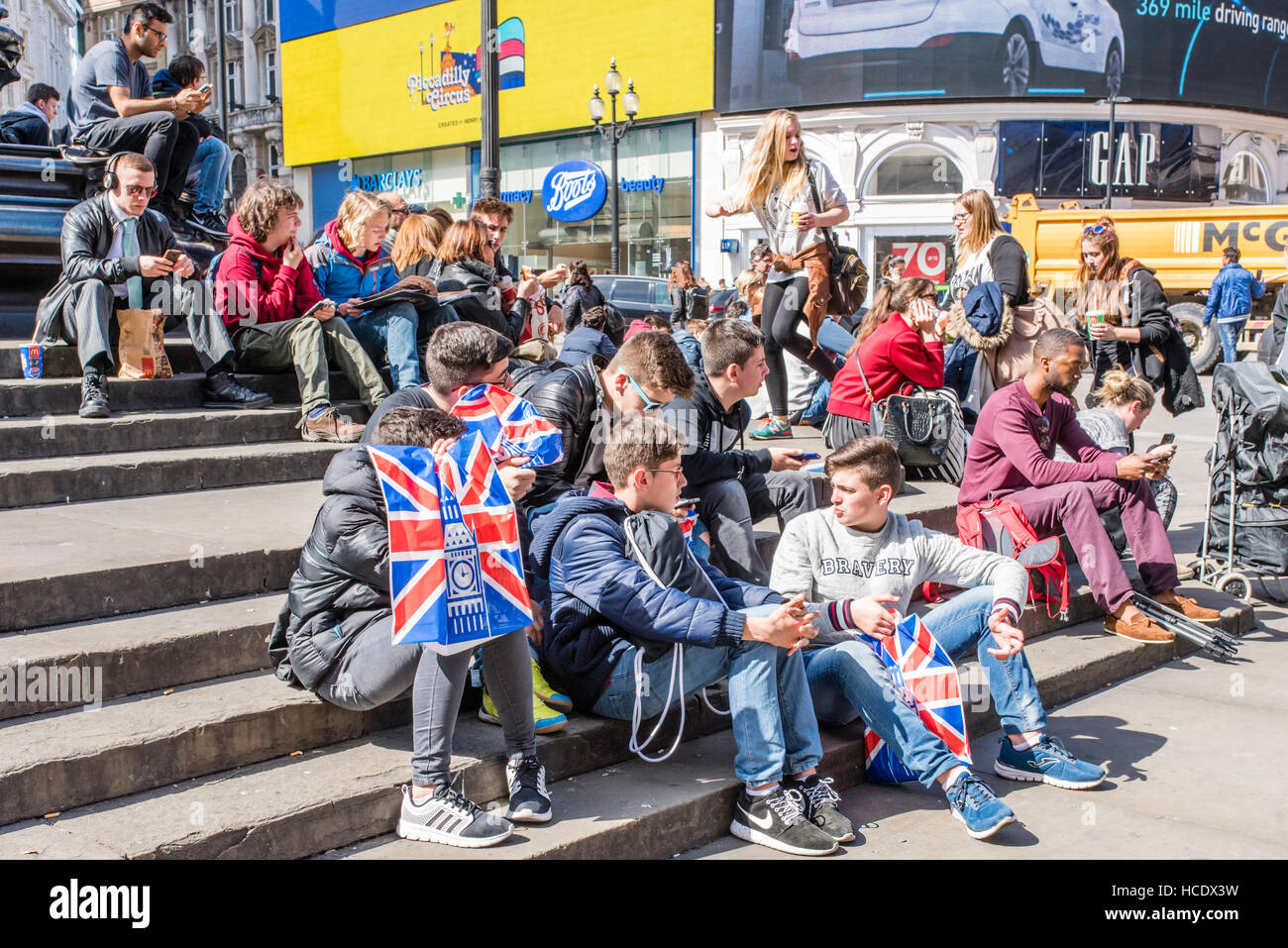 Group of tourists piccadilly hi-res stock photography and images - Alamy