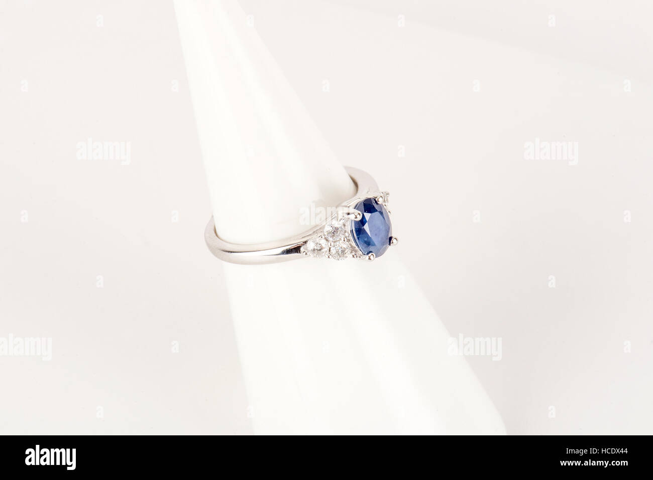 Diamond ring with gold and silver and precious stones. Shot standing up ...