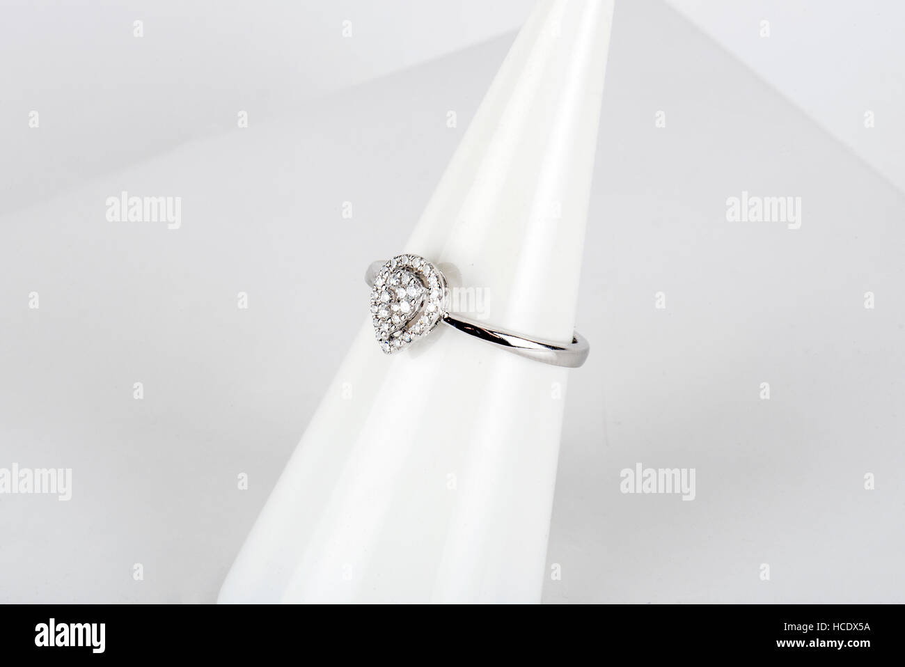 Diamond ring with gold and silver and precious stones. Shot standing up ...