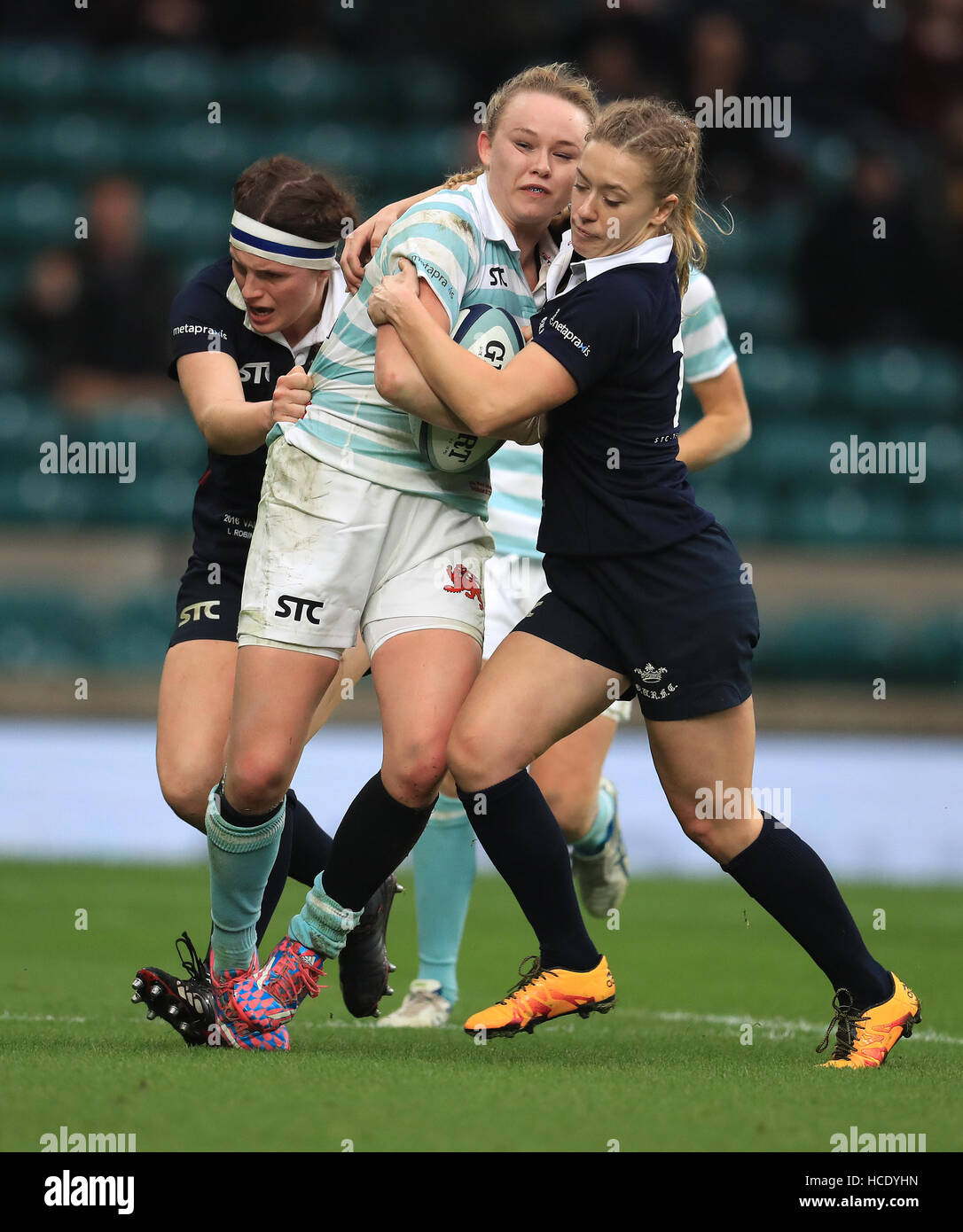 Oxford's Hester Odgers and Amelia Rose tackle Cambridge's Emily Pratt ...