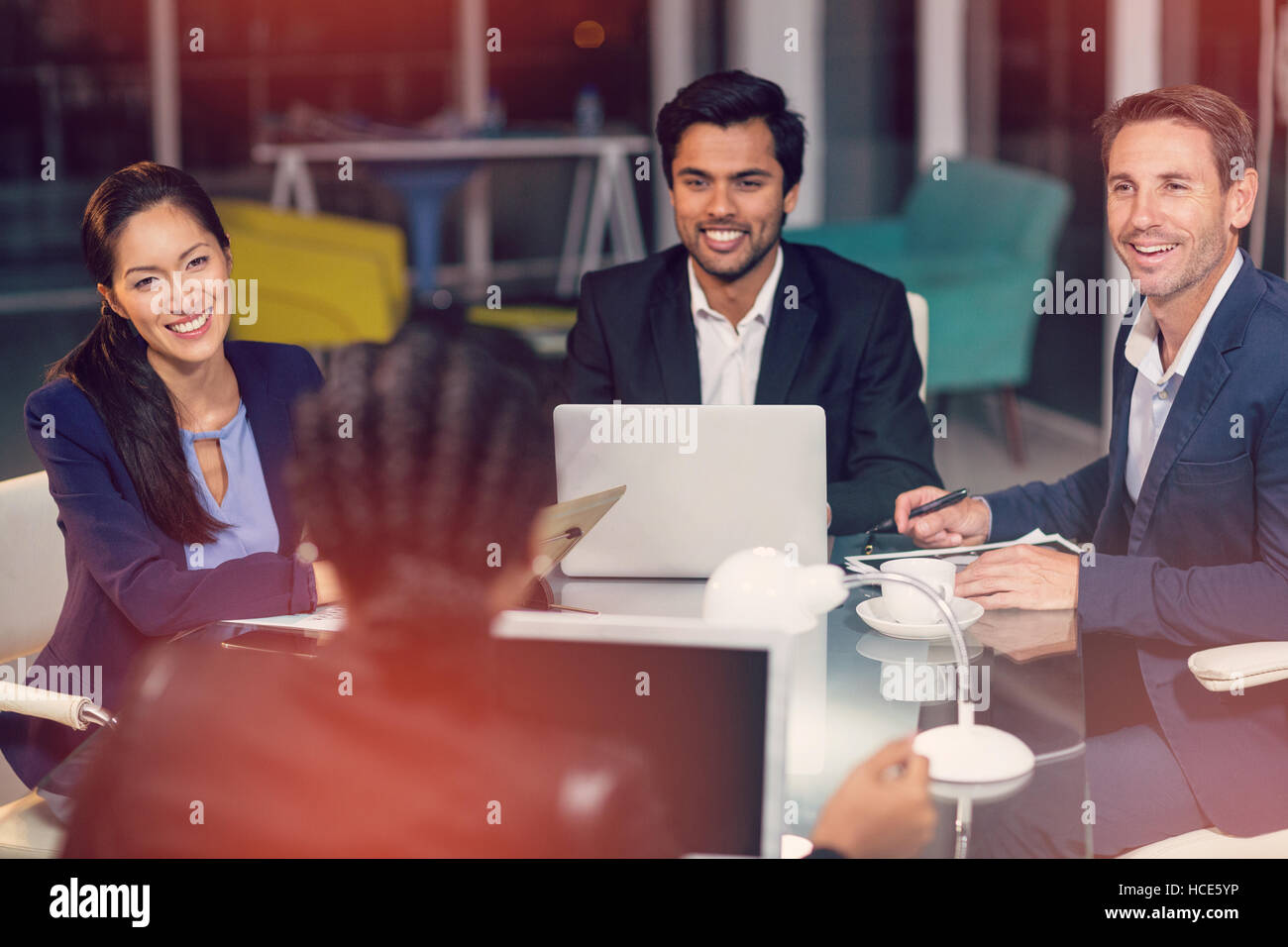 Group of businesspeople interacting with each other in meeting Stock ...