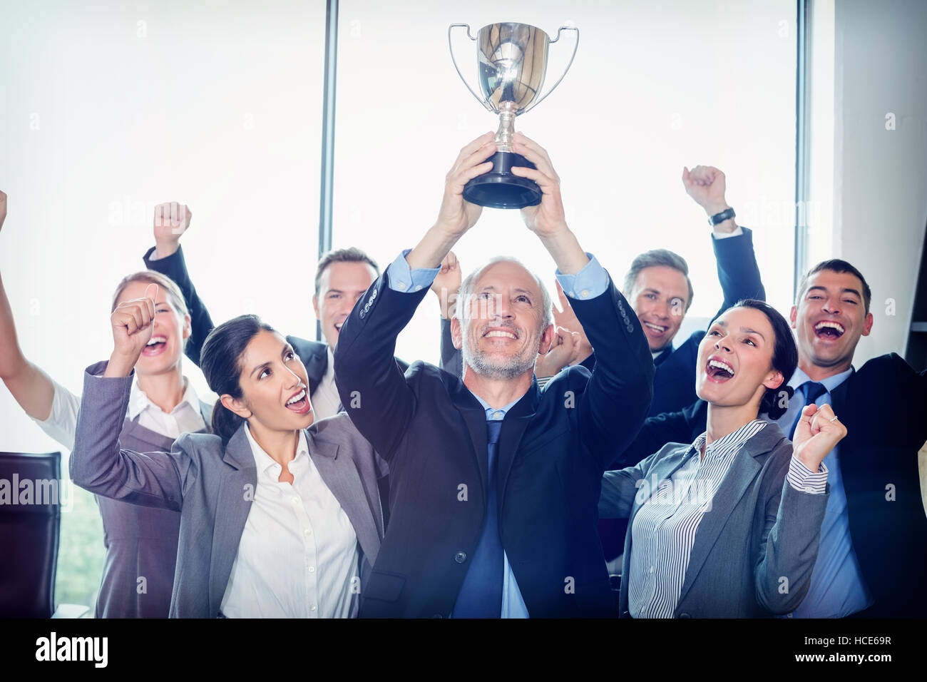 Business man trophy hi-res stock photography and images - Alamy