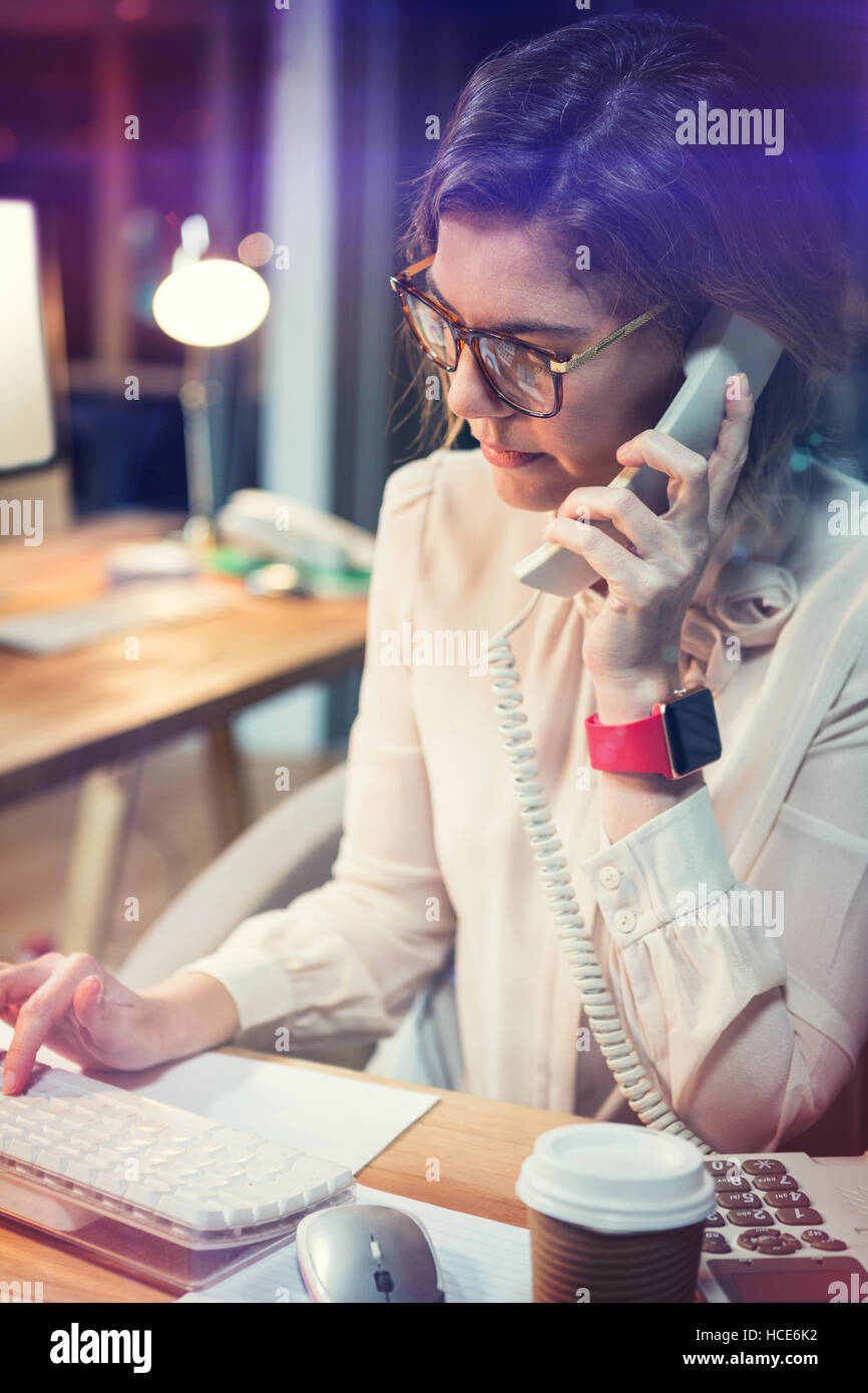 Multitasking woman work working talking hi-res stock photography and ...