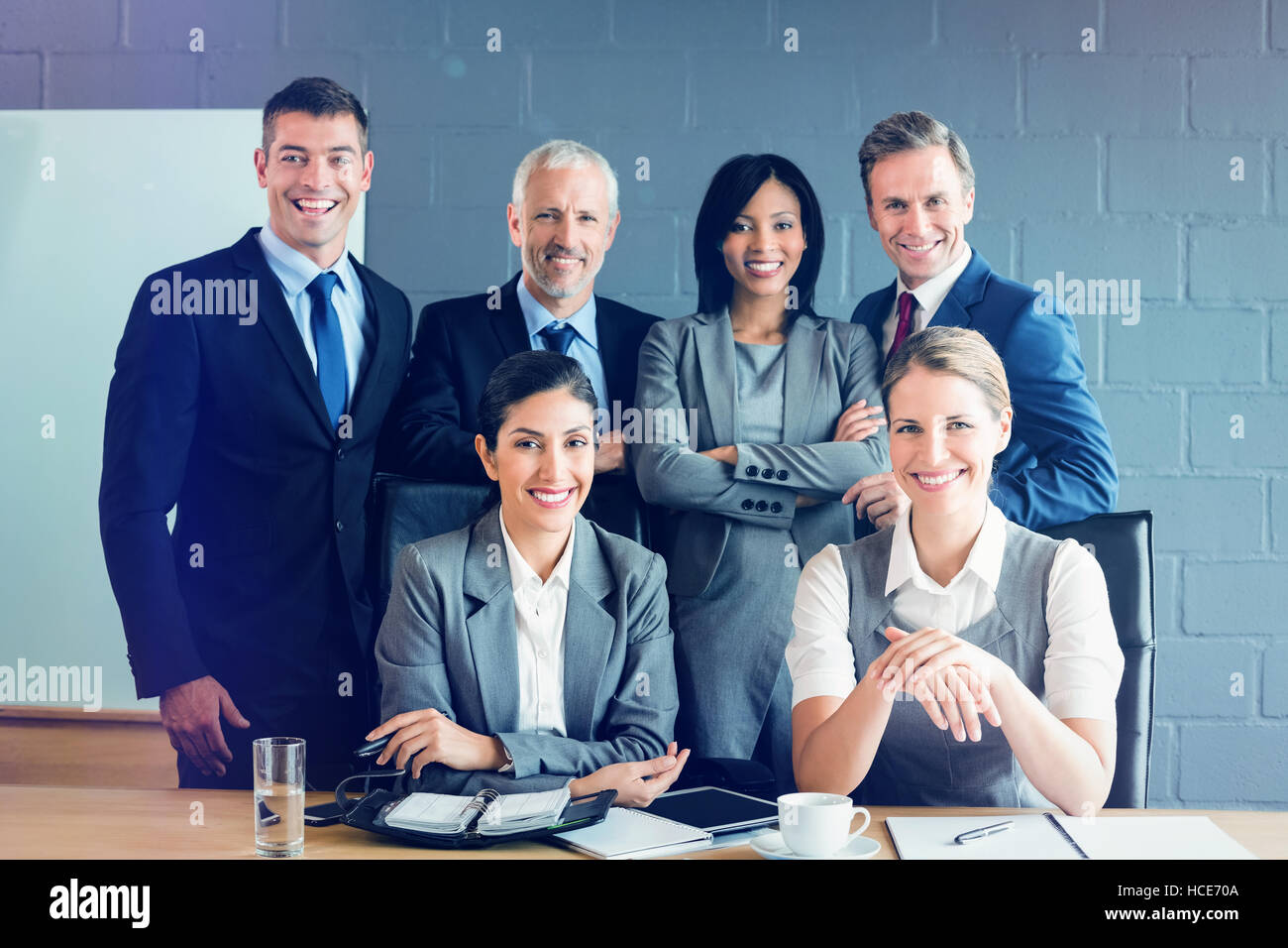 Portrait of smiling business people in conference room Stock Photo - Alamy