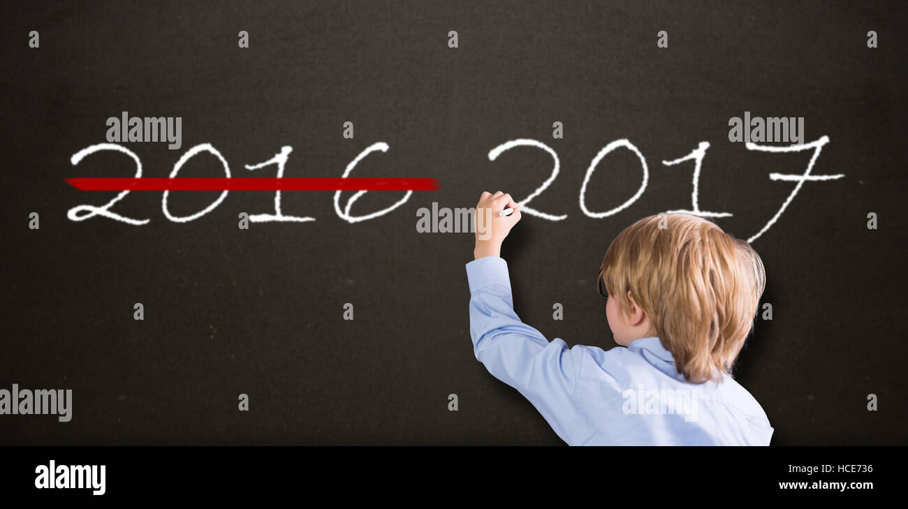 Composite image of cute pupil writing Stock Photo - Alamy