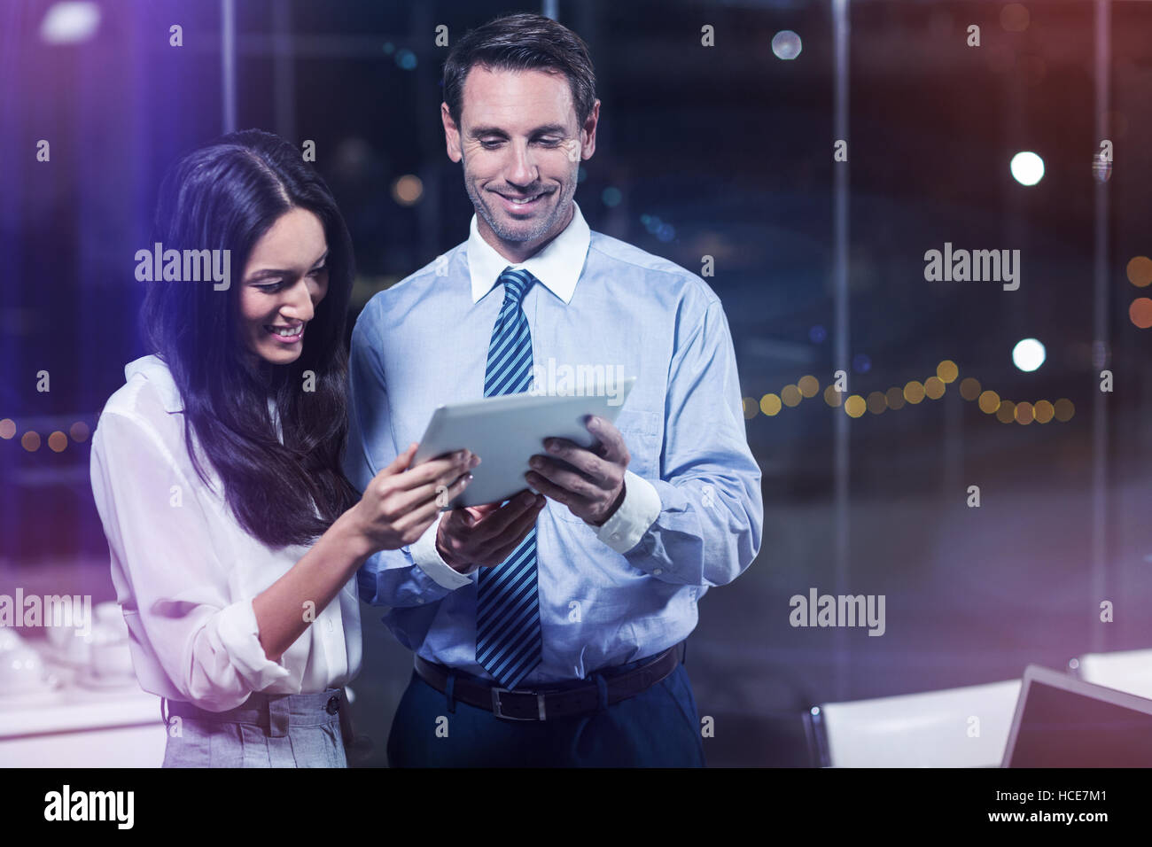 Happy businessman talking showing digital hi-res stock photography and images - Alamy