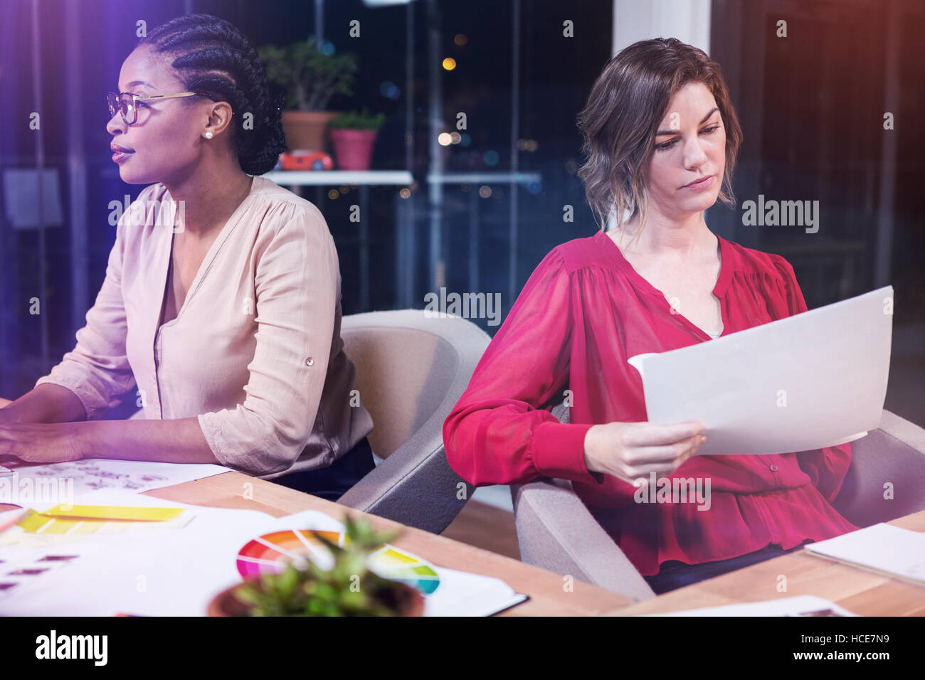Businesswomen working at desk Stock Photo - Alamy