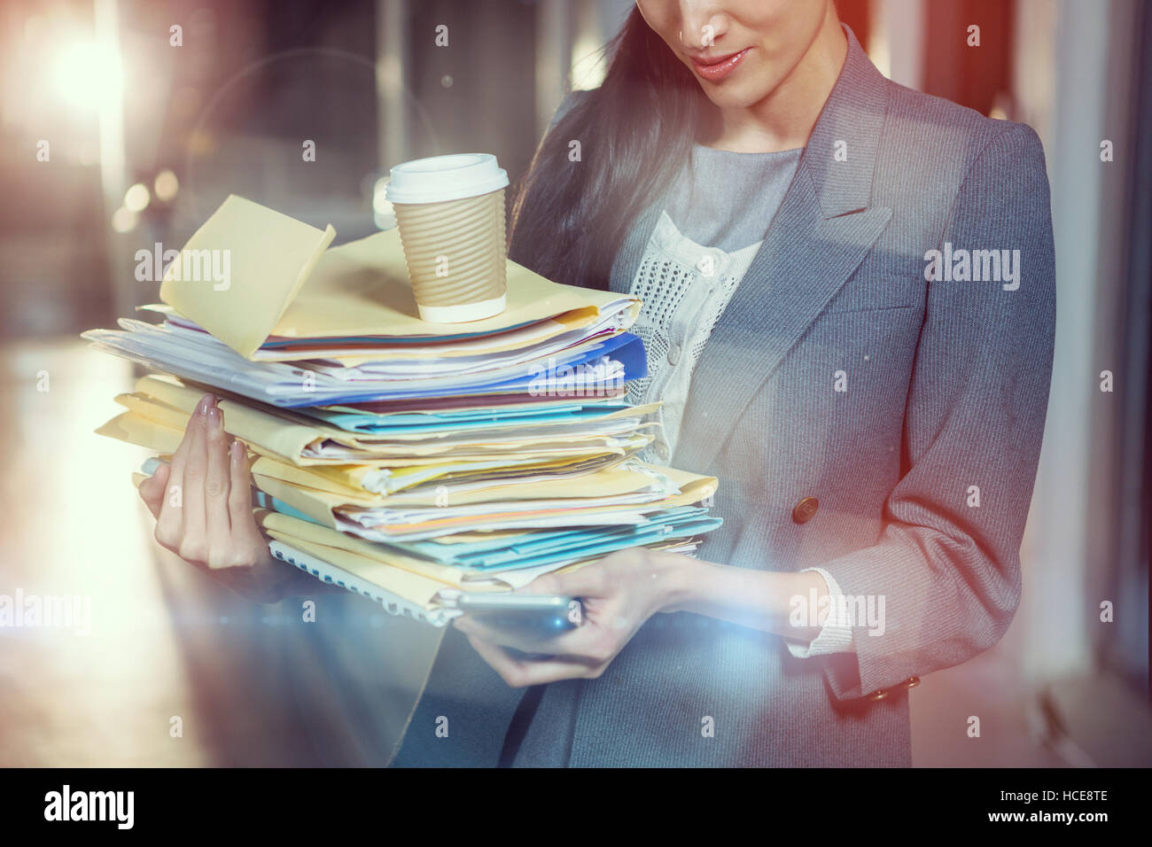 Well dressed woman carrying folder hi-res stock photography and images ...