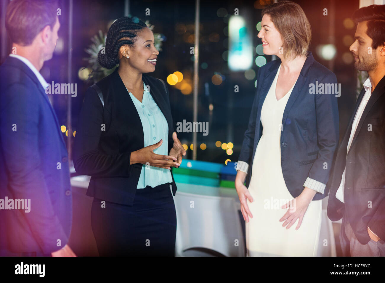 Group of businesspeople interacting with each other Stock Photo - Alamy