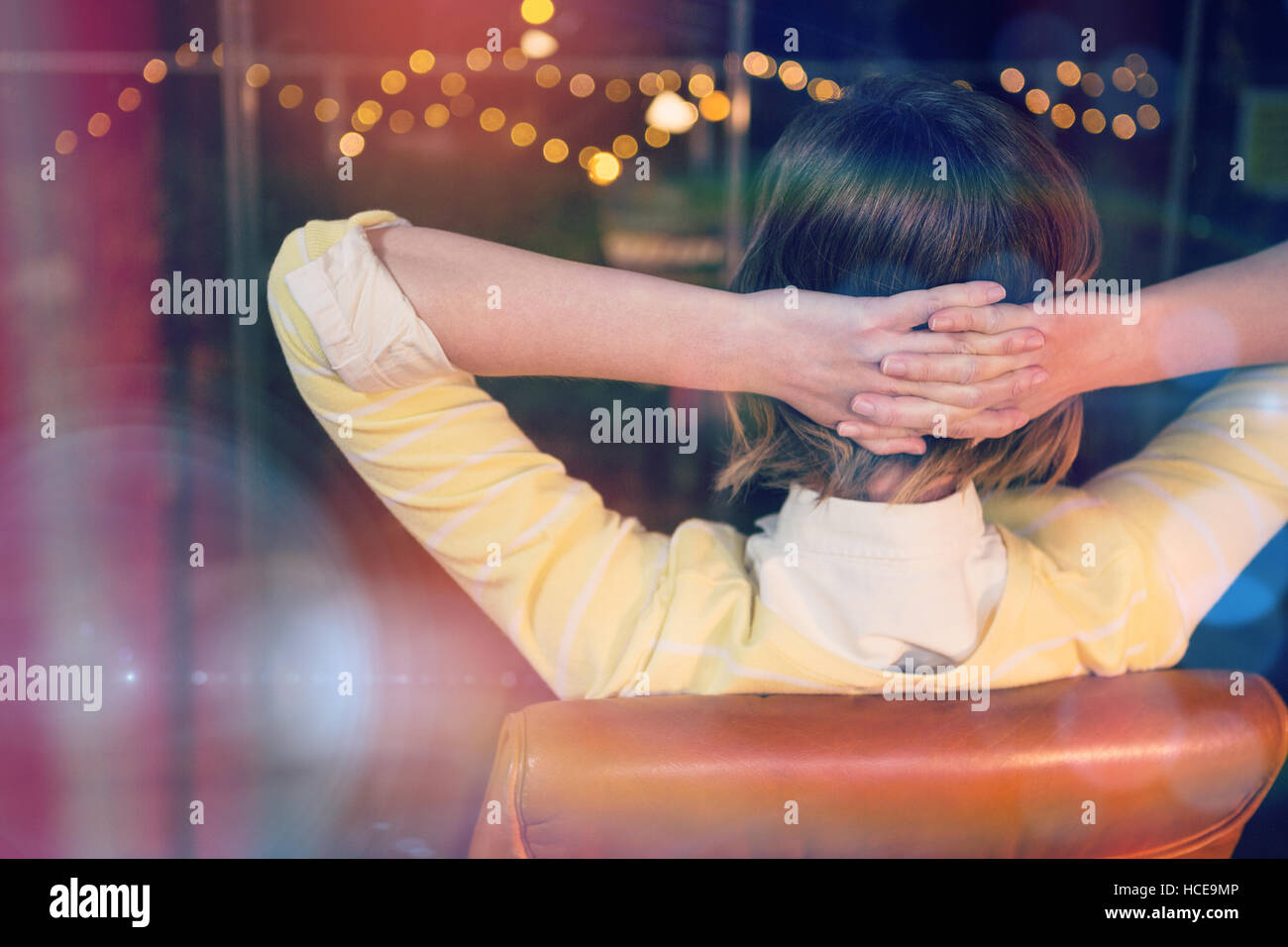 Businesswoman sitting on chair looking through window Stock Photo - Alamy