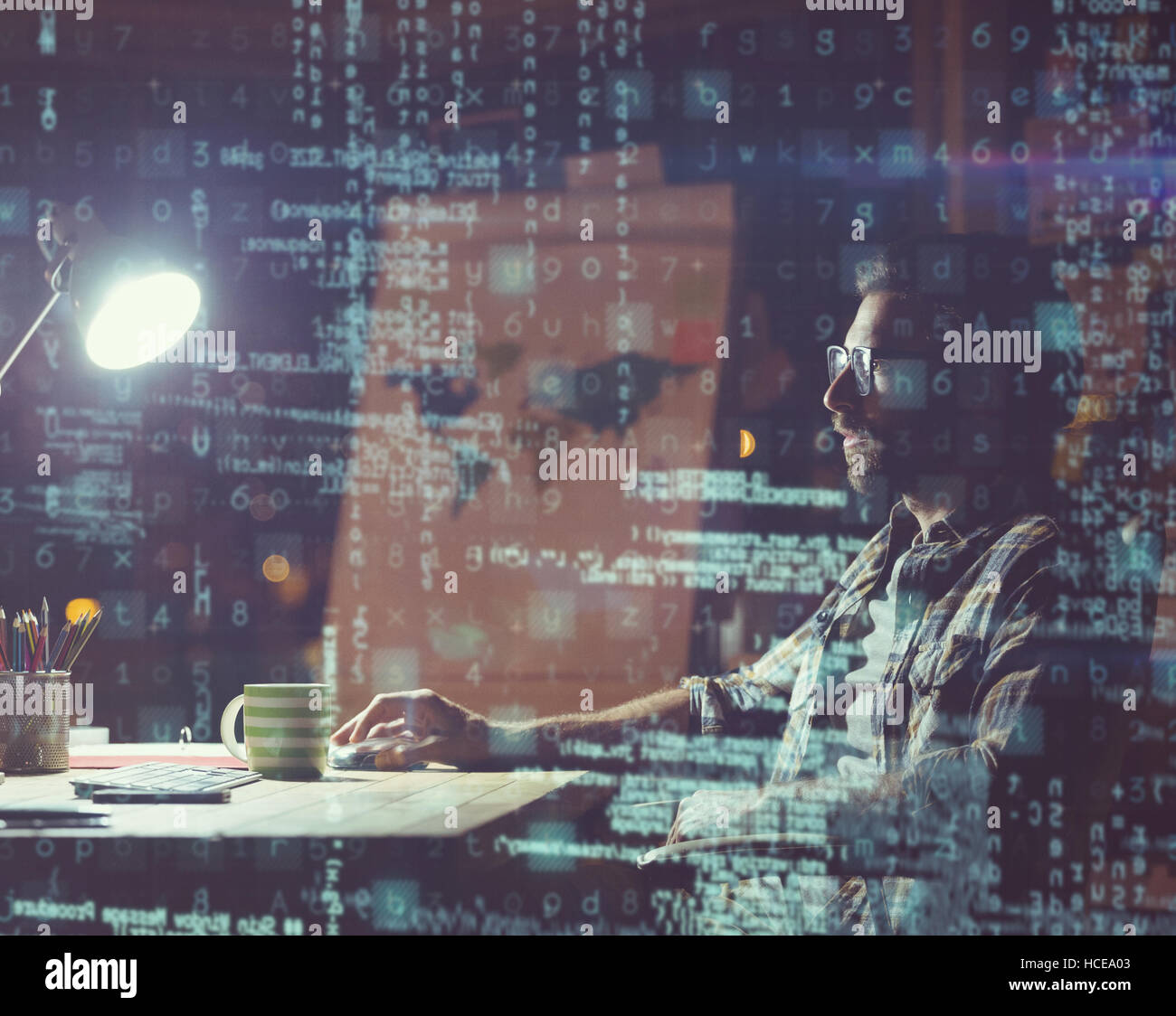 Businessman using computer at night Stock Photo - Alamy
