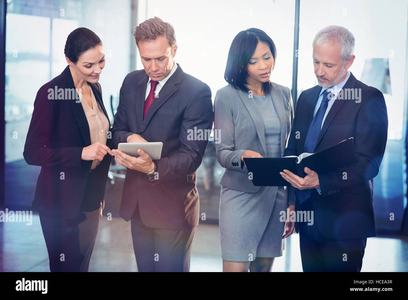 Team of business people interacting Stock Photo - Alamy