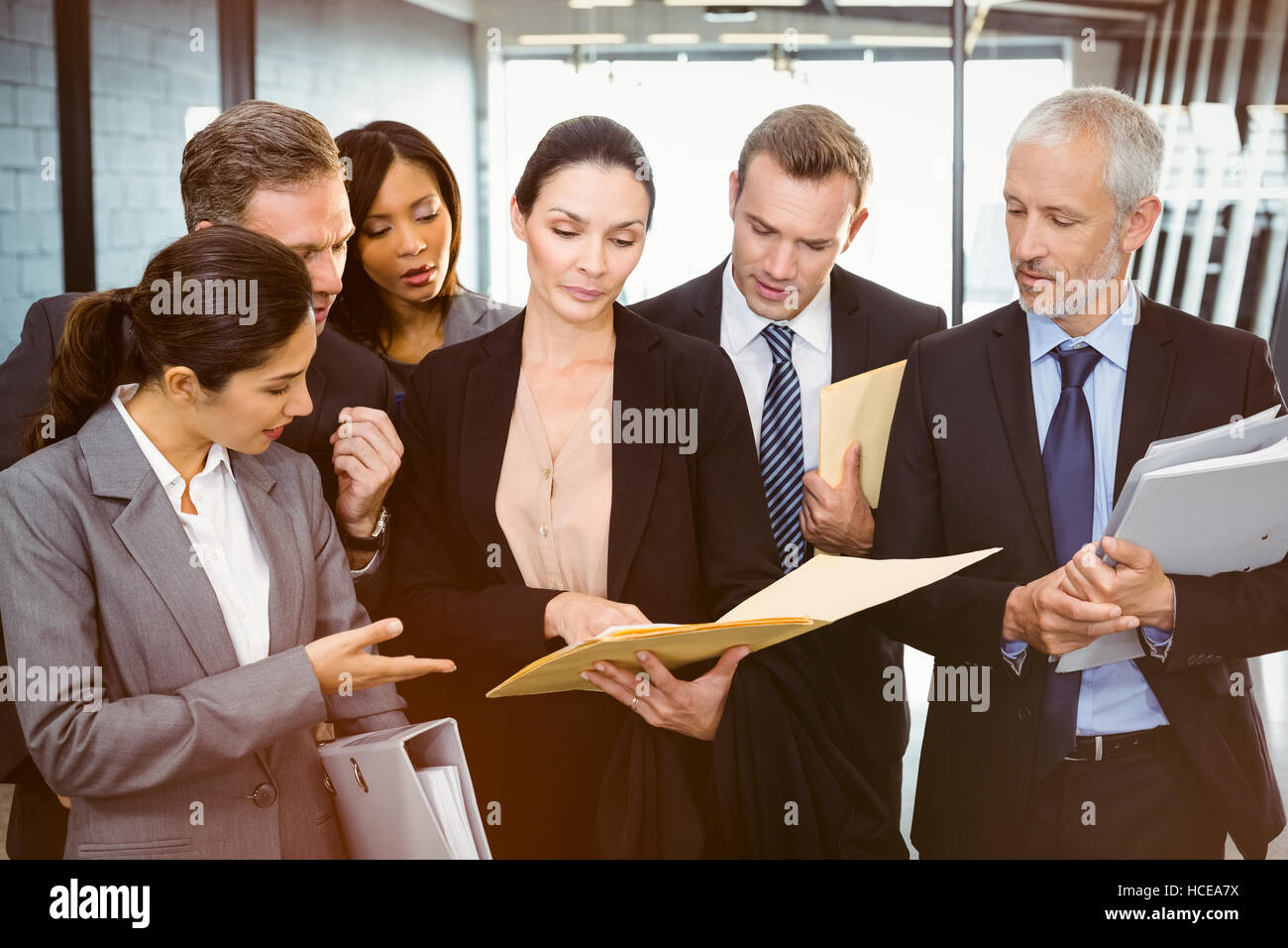 Business people looking documents hi-res stock photography and images ...