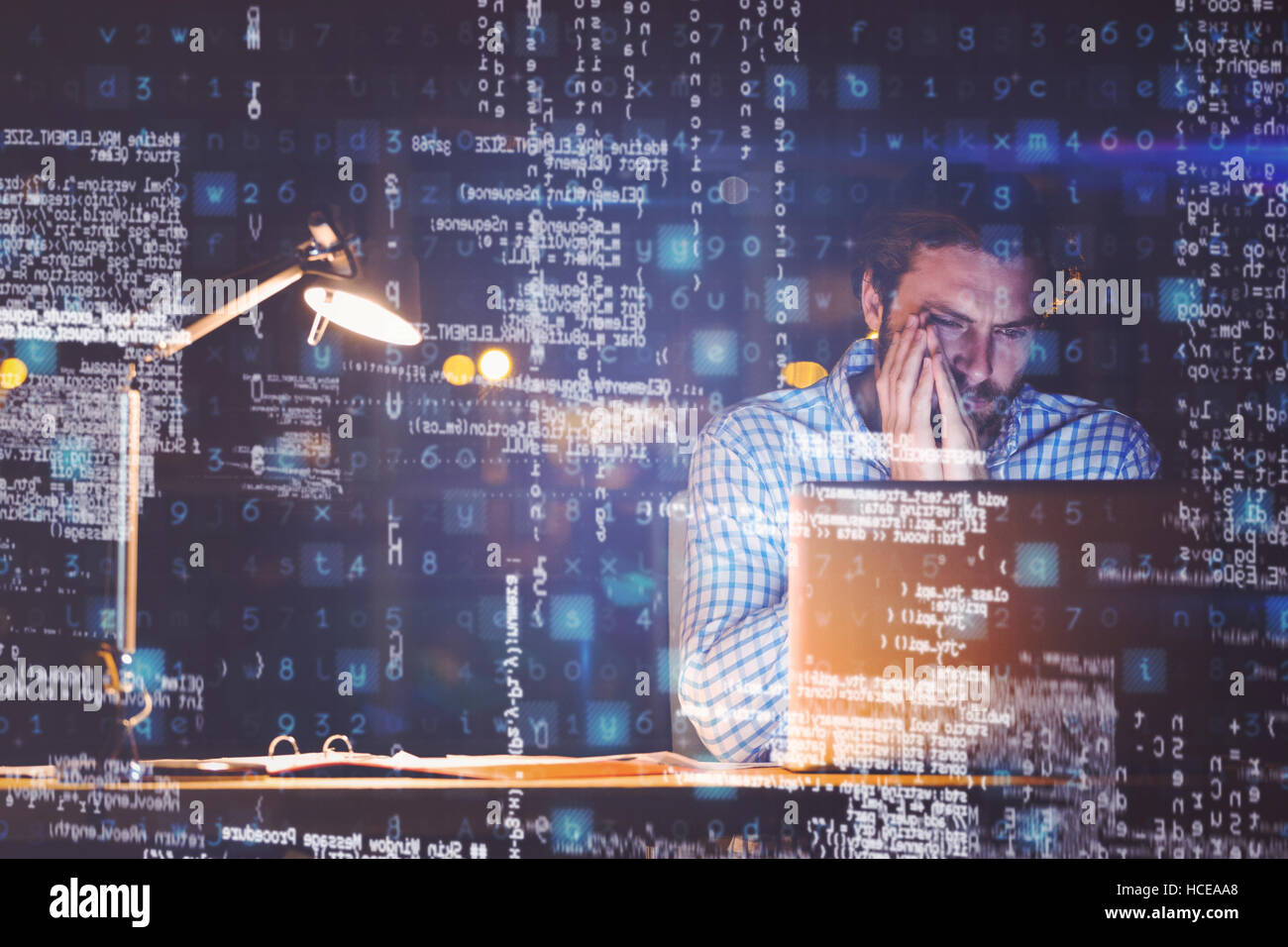 Overworked businessman working at night Stock Photo - Alamy
