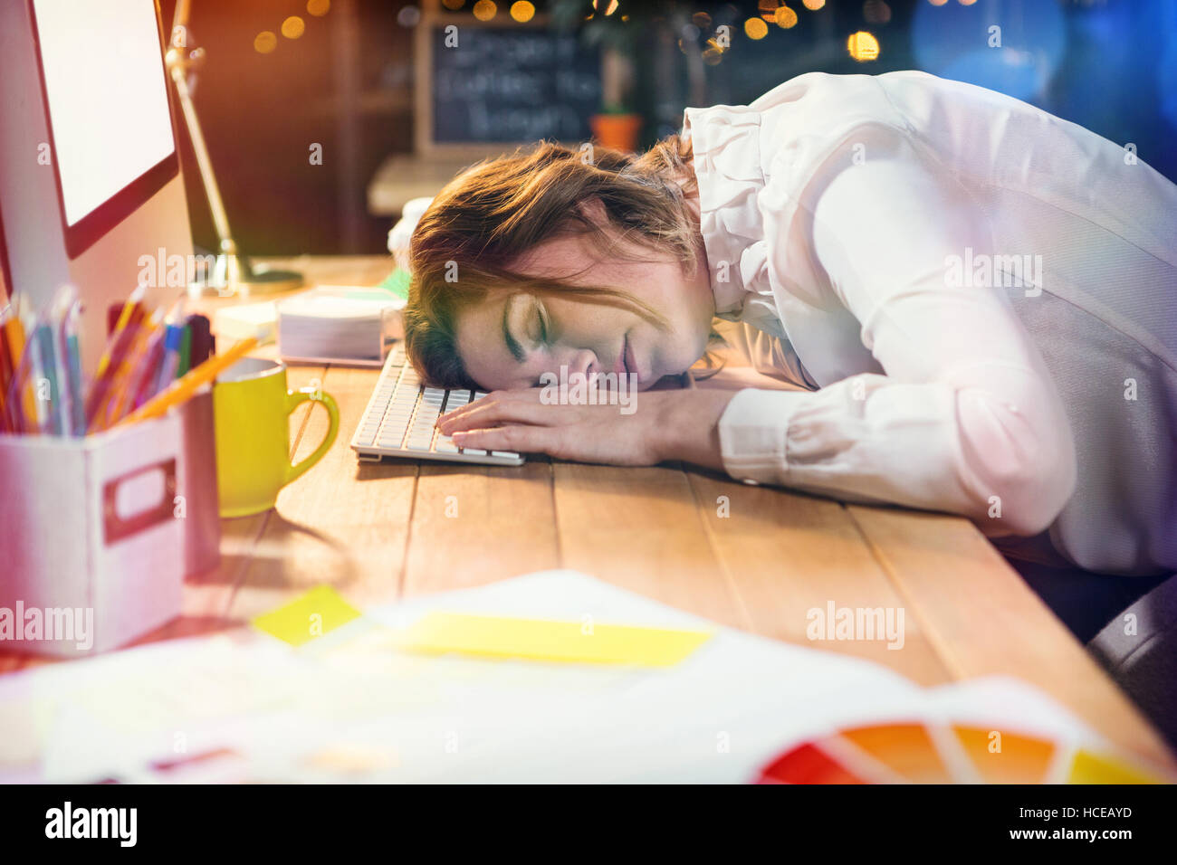 Tired businesswoman sleeping on desk Stock Photo - Alamy