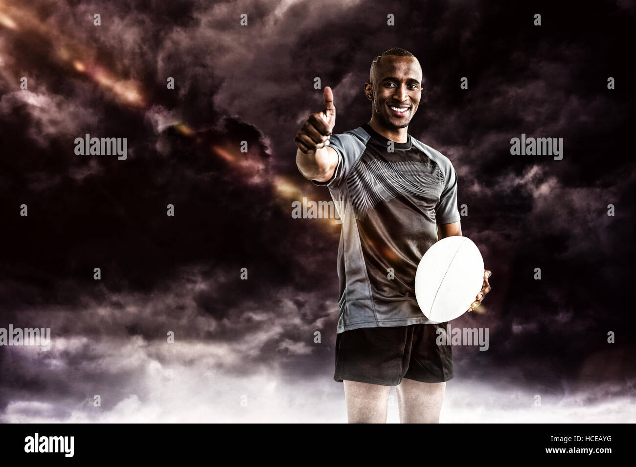 Composite image of portrait of confident rugby player smiling and ...