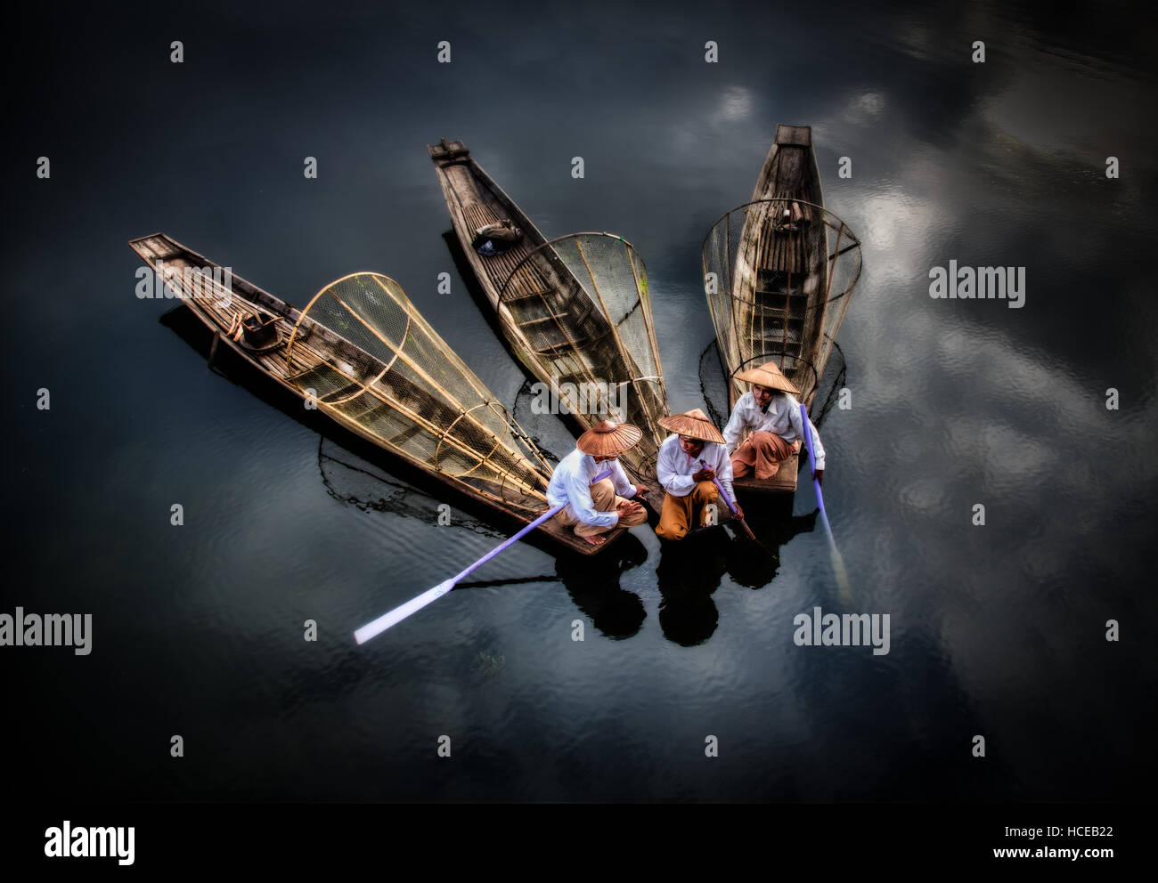 Three fishermen in boats hi-res stock photography and images - Alamy