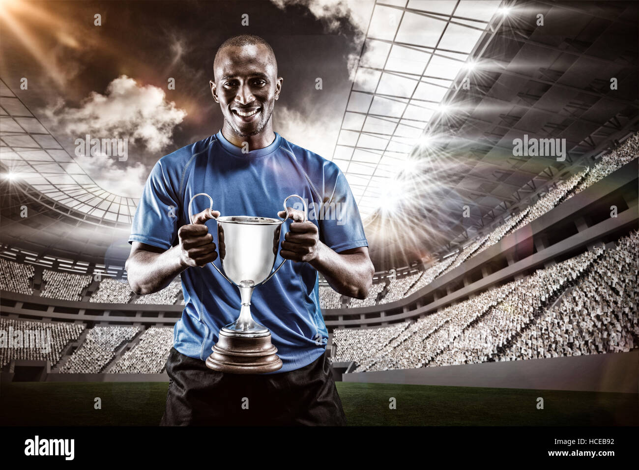 Composite image 3D of portrait of happy athlete holding trophy Stock ...