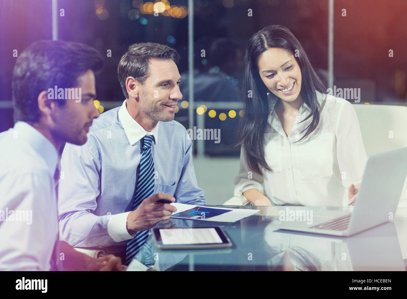Businesswoman discussing with colleagues Stock Photo - Alamy