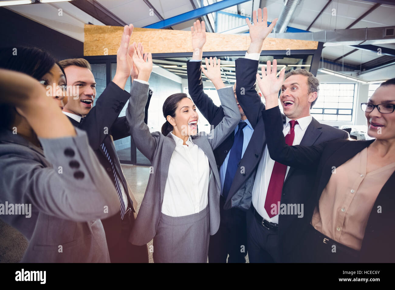 Office raising hands hi-res stock photography and images - Alamy