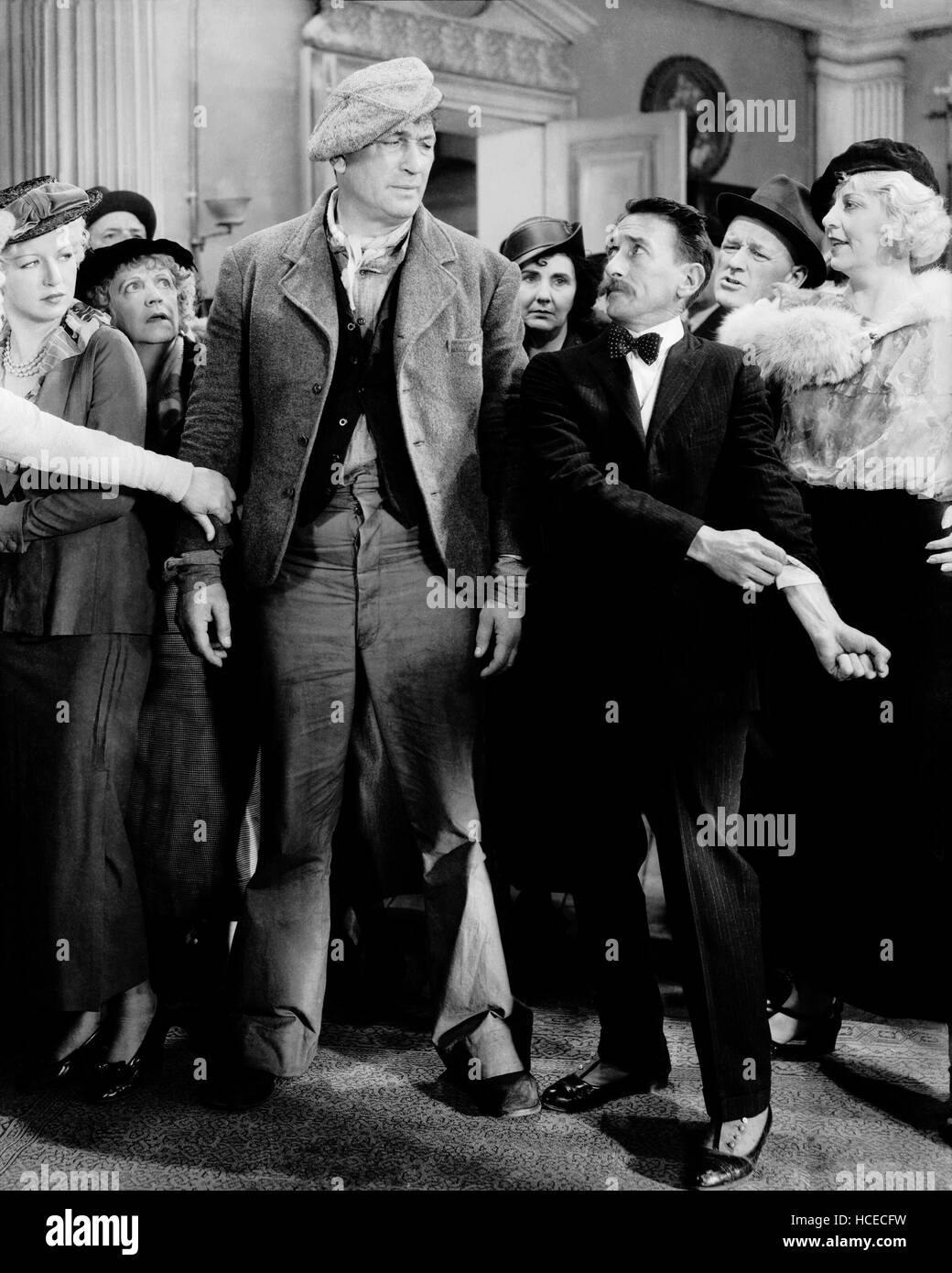 THE INFORMER, fifth and seventh from left: Victor McLaglen, Clyde Cook ...