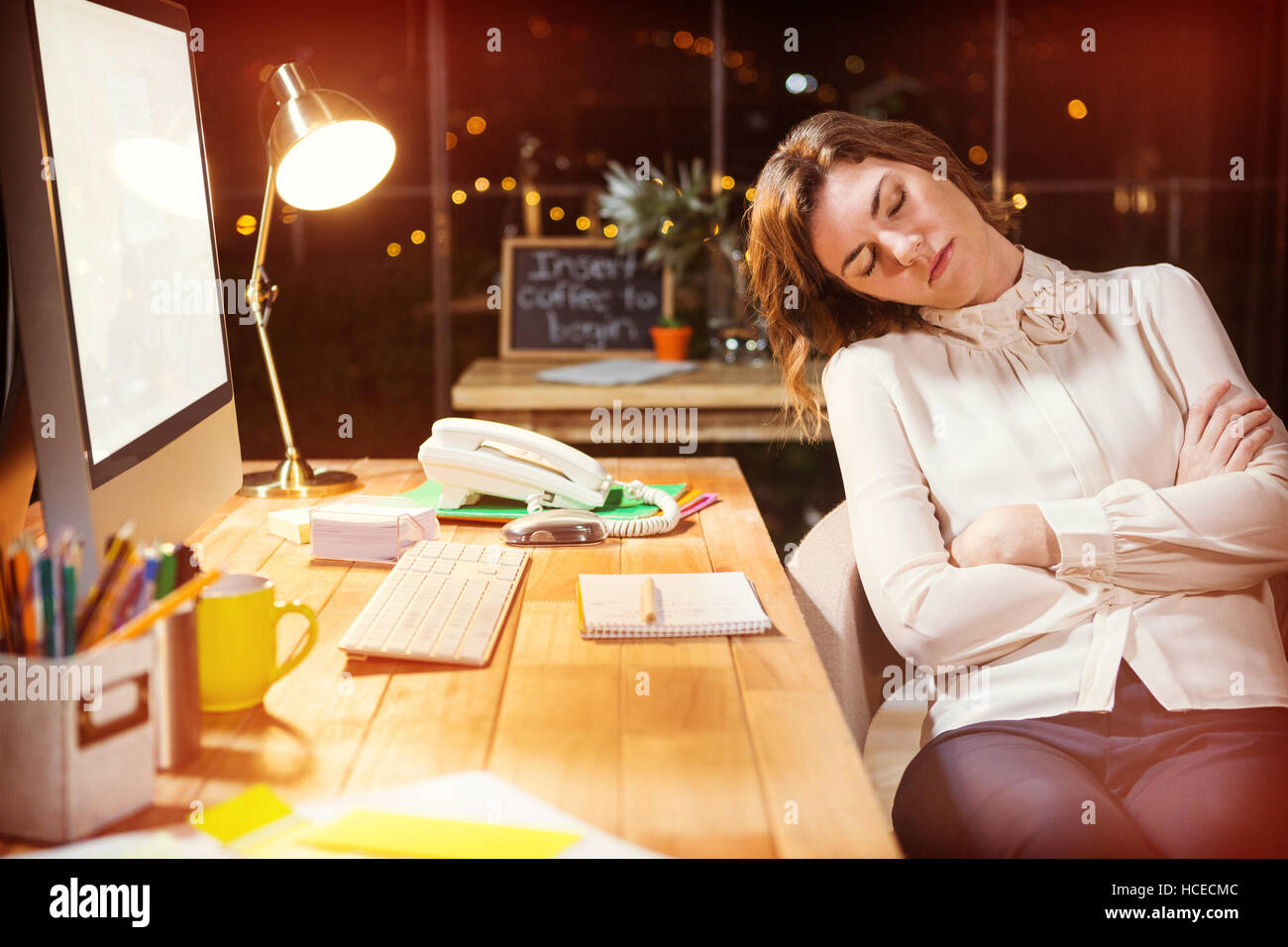 Tired businesswoman sleeping on chair Stock Photo - Alamy