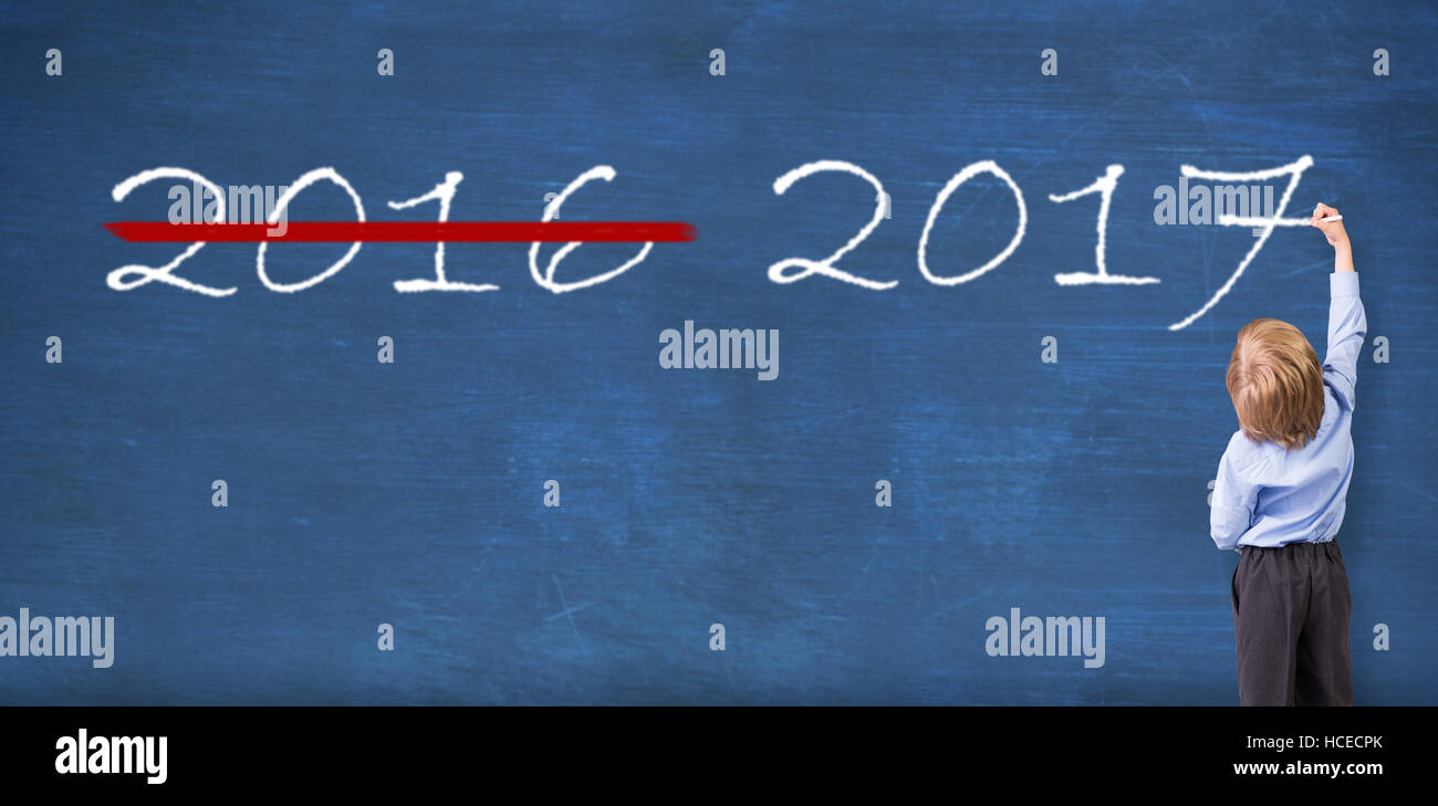 Composite image of cute pupil writing Stock Photo - Alamy