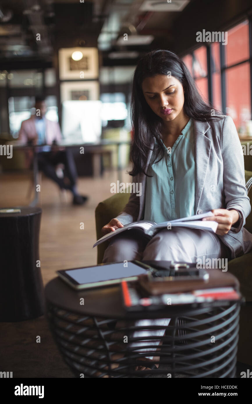 Entrepreneur reading book hi-res stock photography and images - Alamy