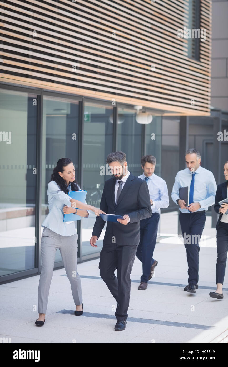 Group of business people walking outside office building Stock Photo ...