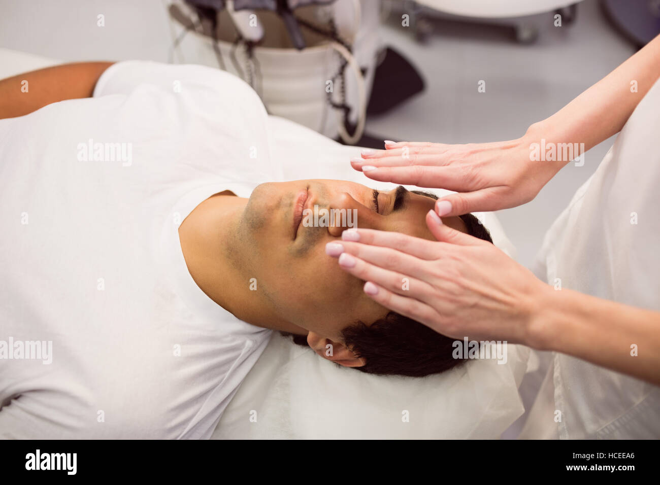 Patient receiving facial treatment Stock Photo - Alamy