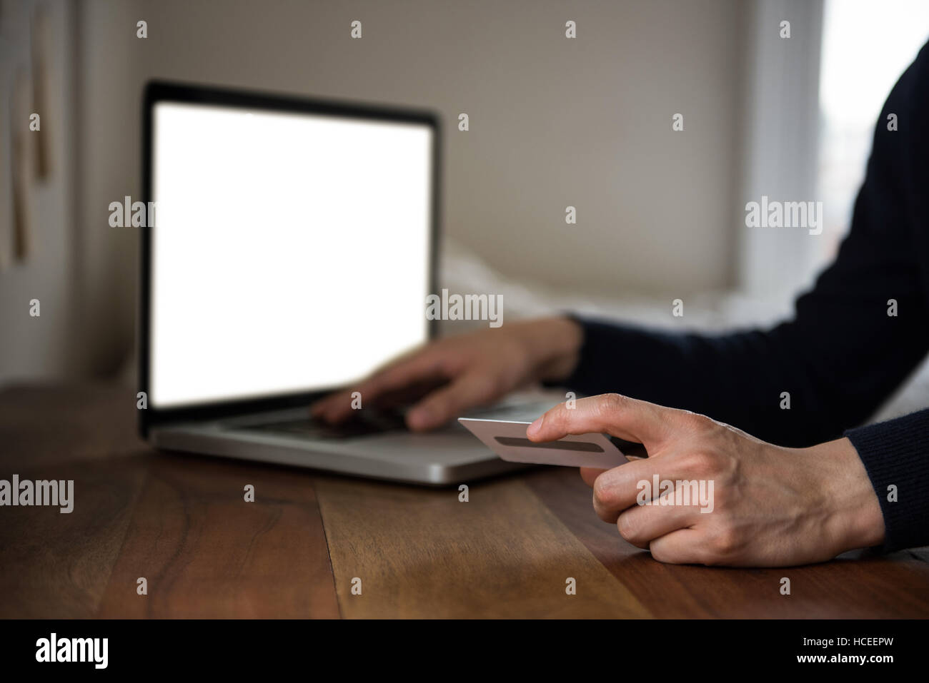 Man doing online shopping on laptop Stock Photo - Alamy